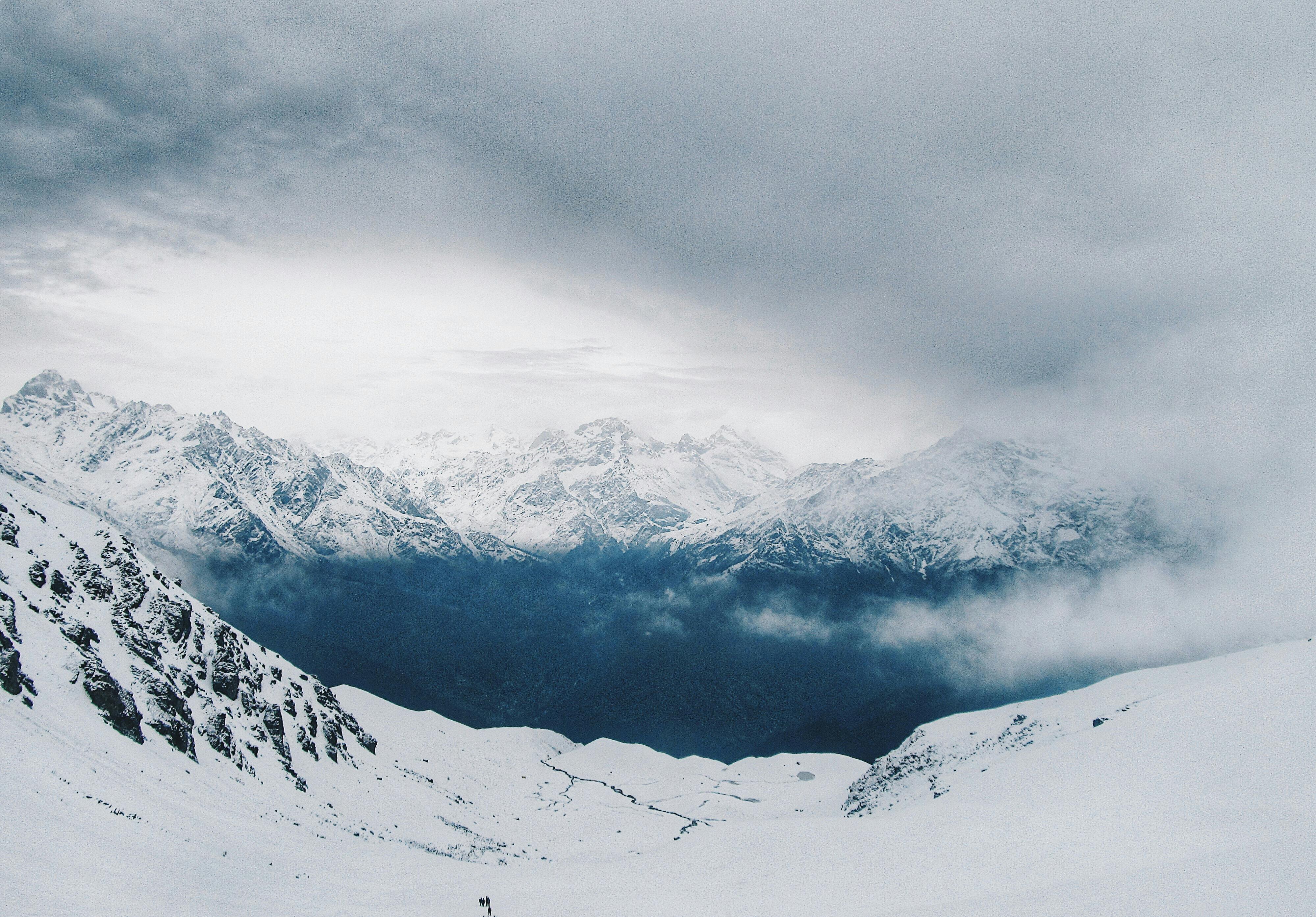 Shadow Covering Snowy Mountain Range · Free Stock Photo