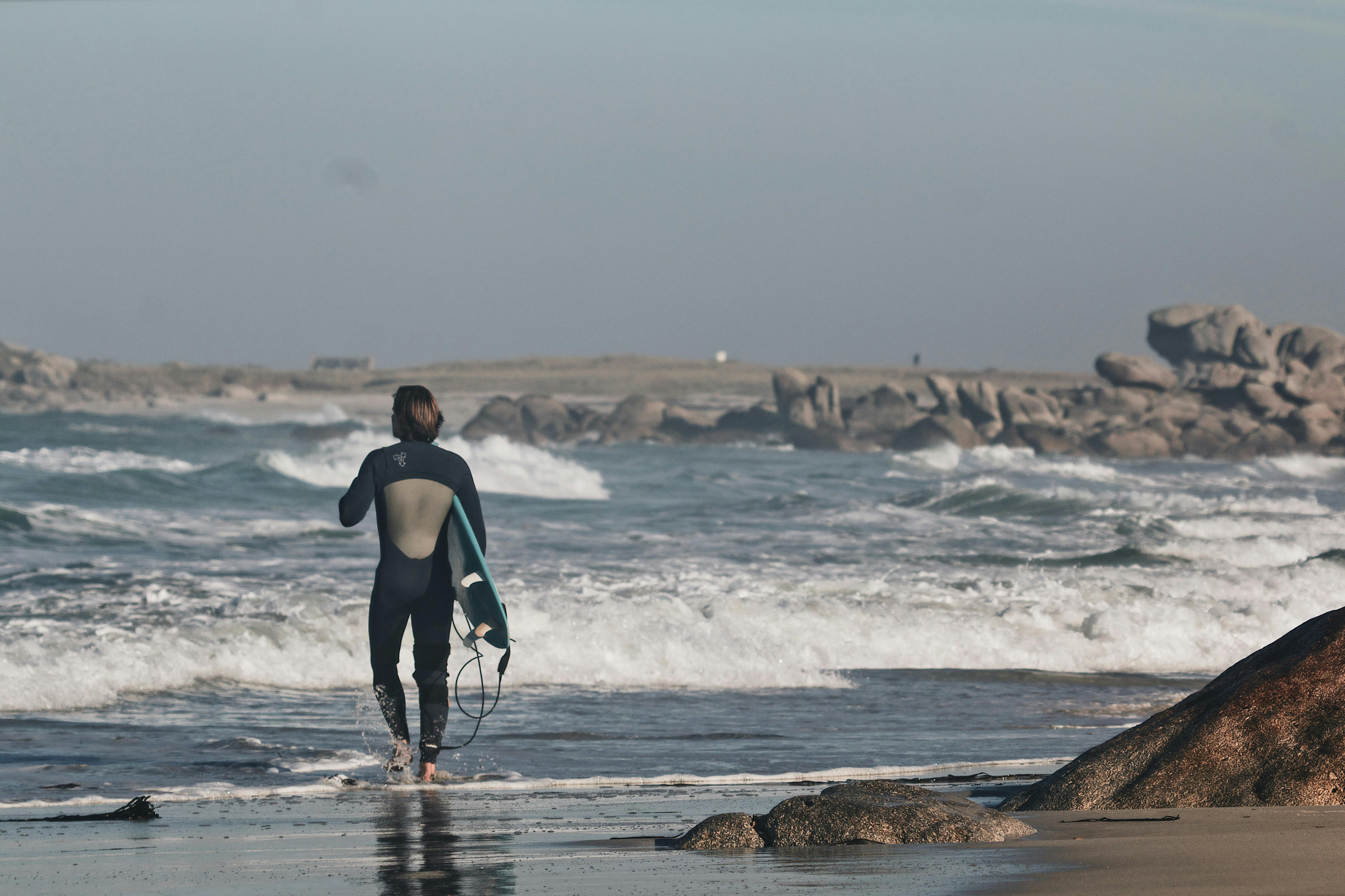 A Surf rider Enjoying His Vacation · Free Stock Photo