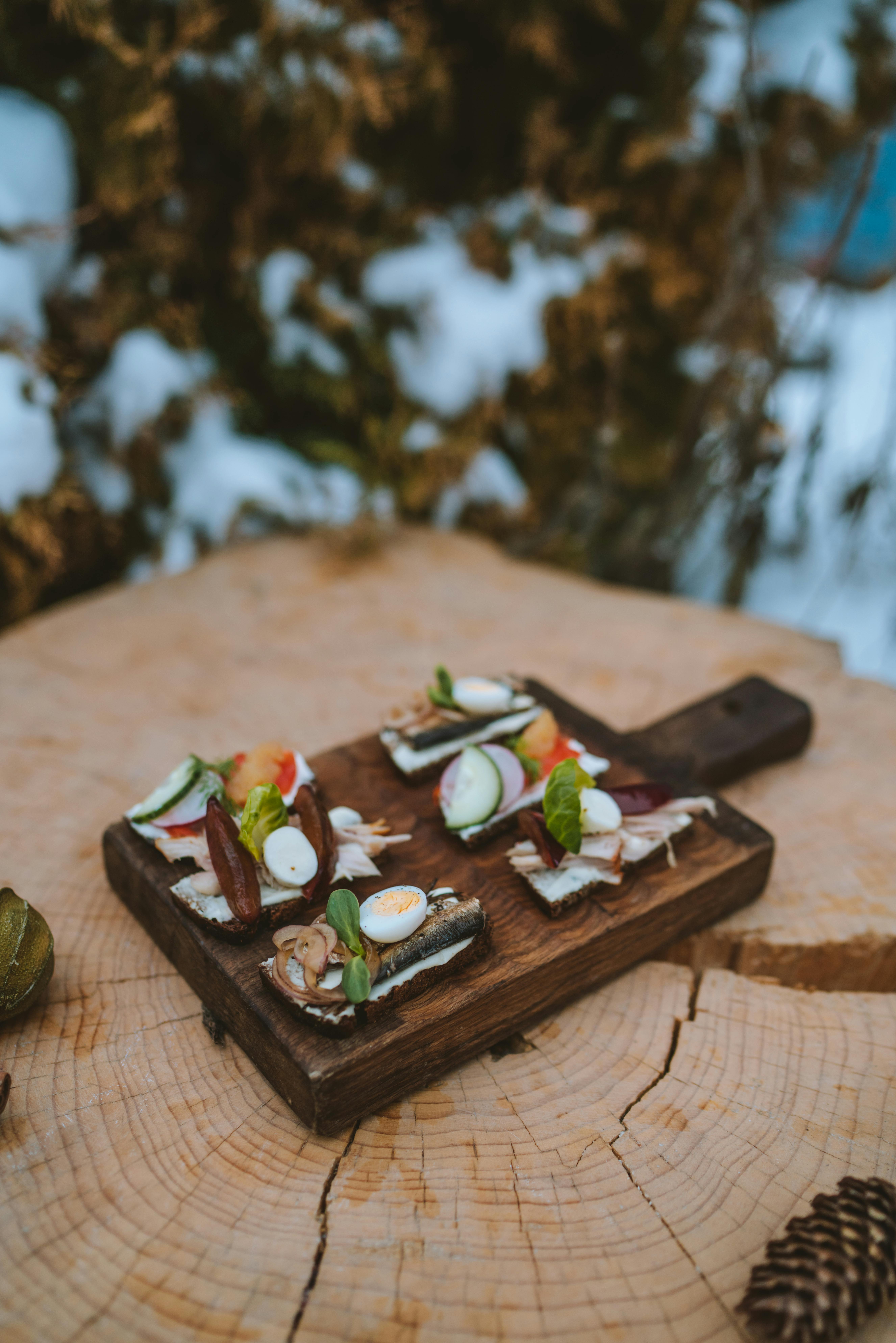 A Tree Stump Carved into a Windmill · Free Stock Photo