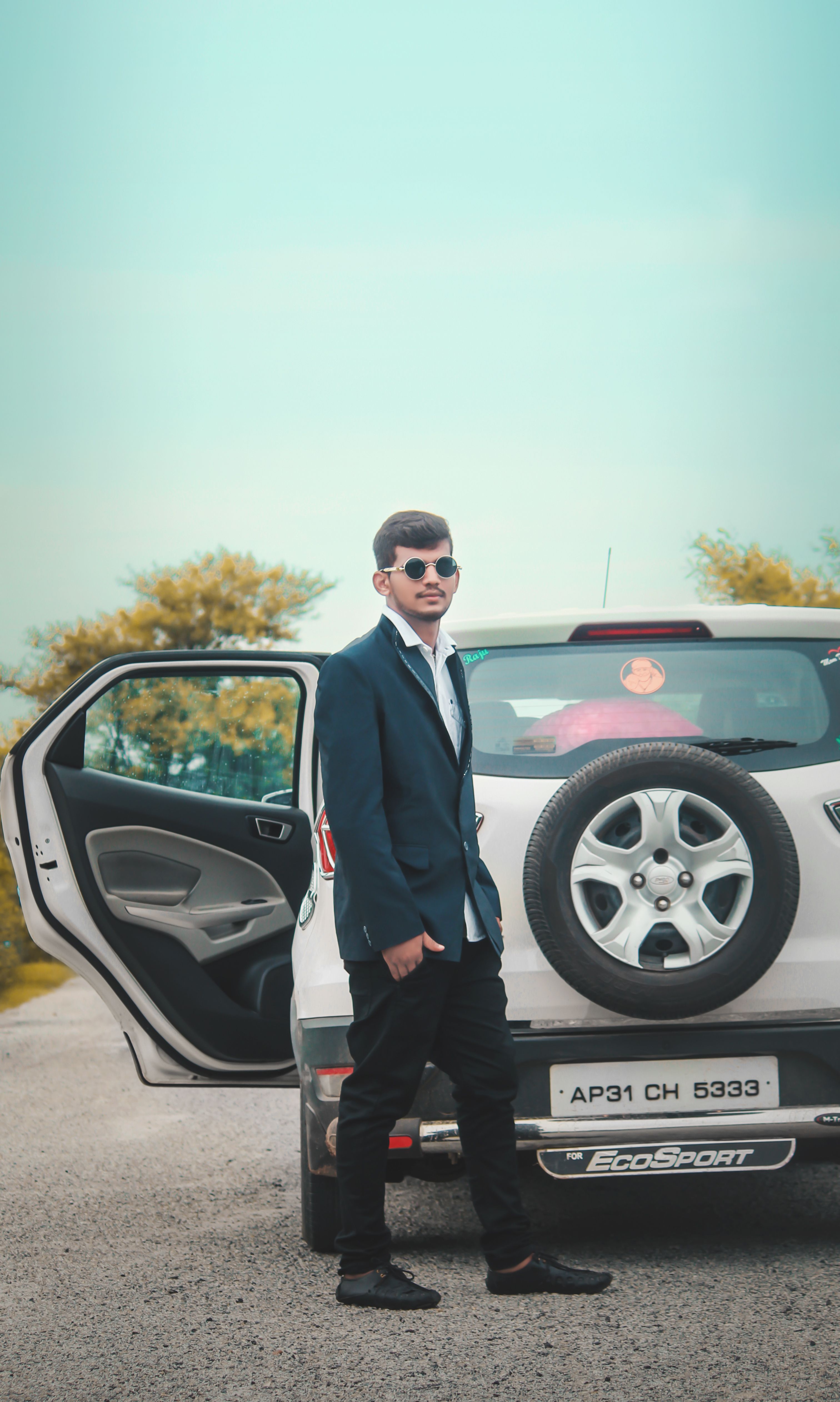 Man in Suit Jacket Standing Behind a Car · Free Stock Photo