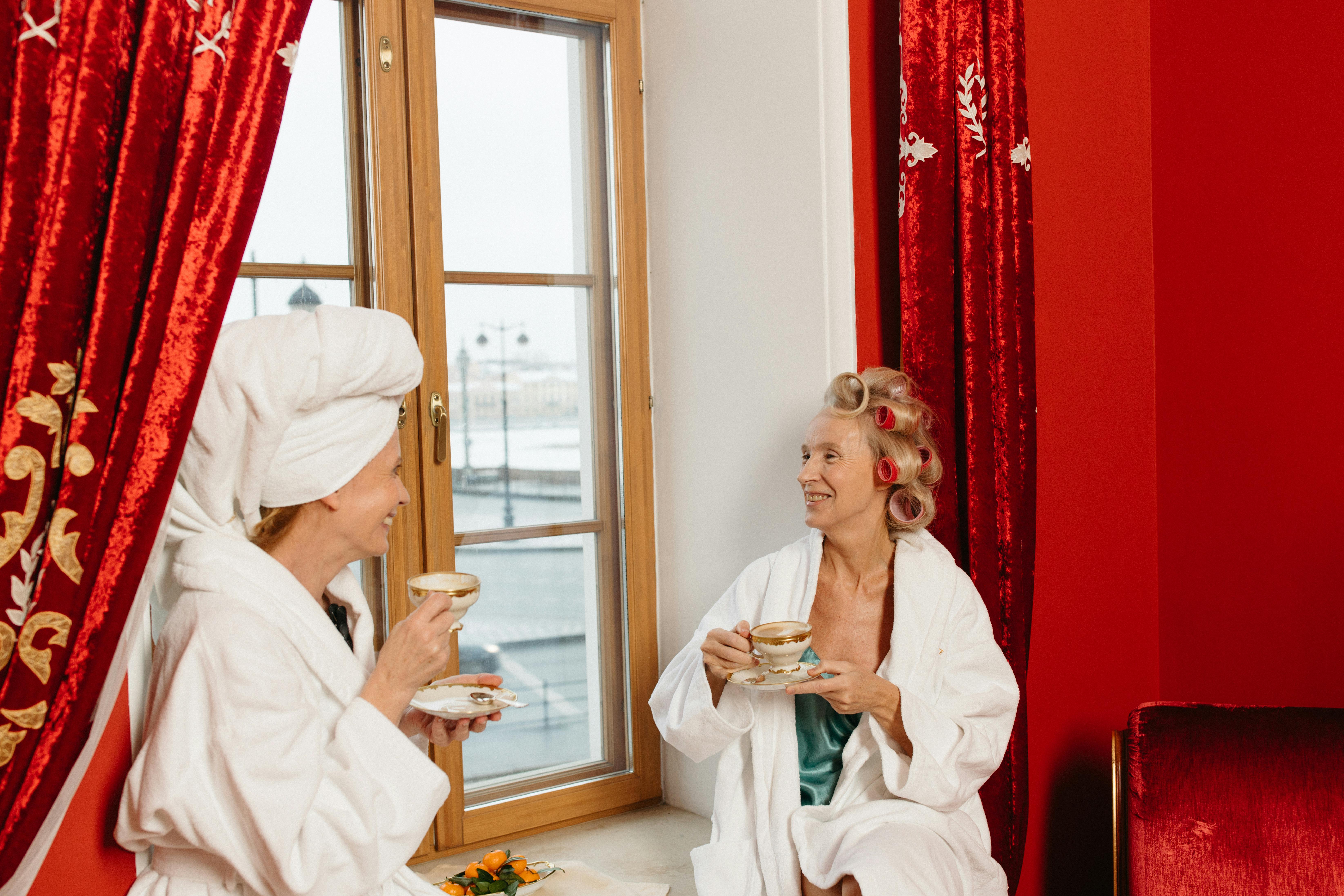 Women in Robes Having Coffee · Free Stock Photo
