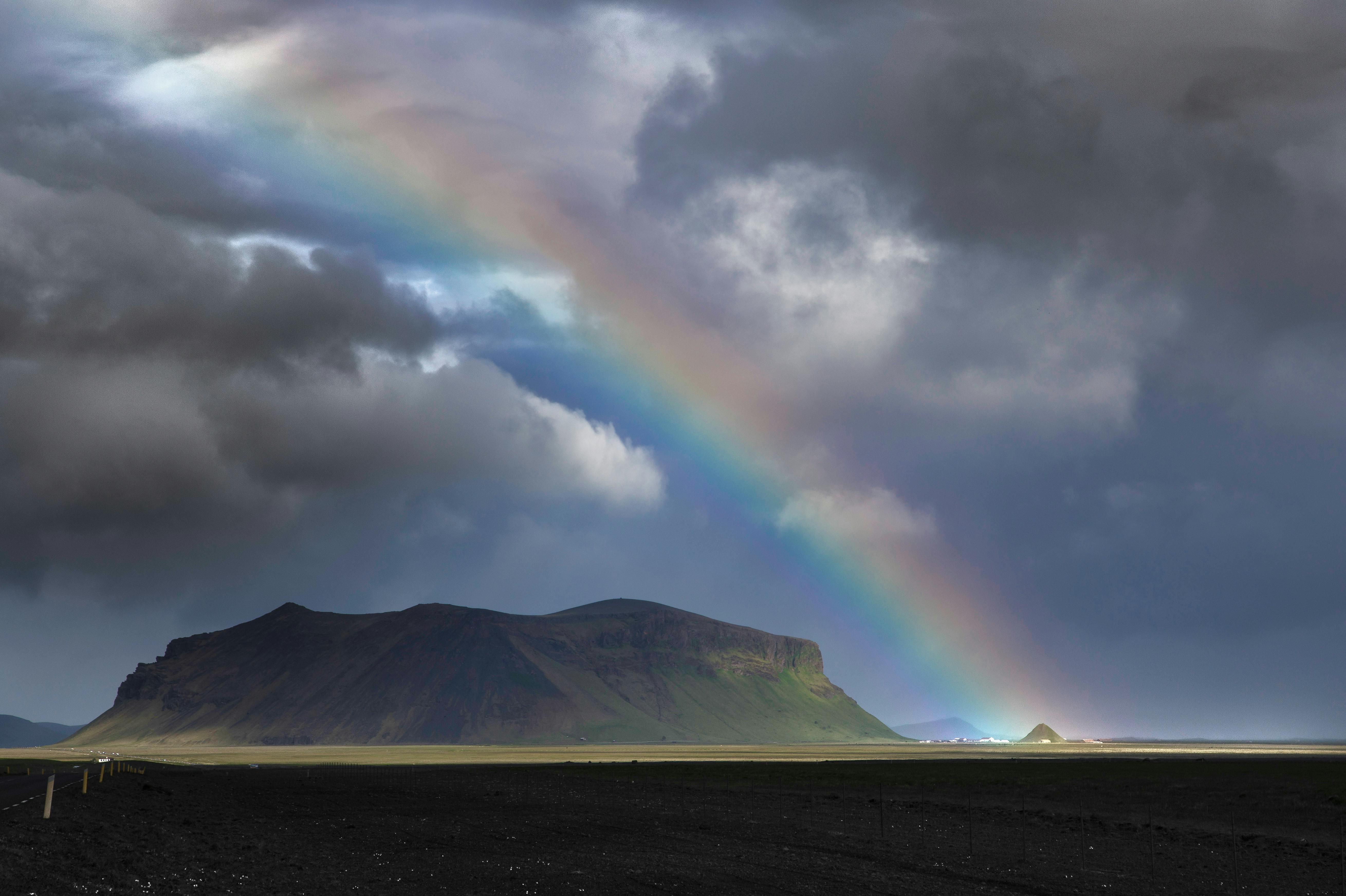 Rainbow over Hill on Plains · Free Stock Photo
