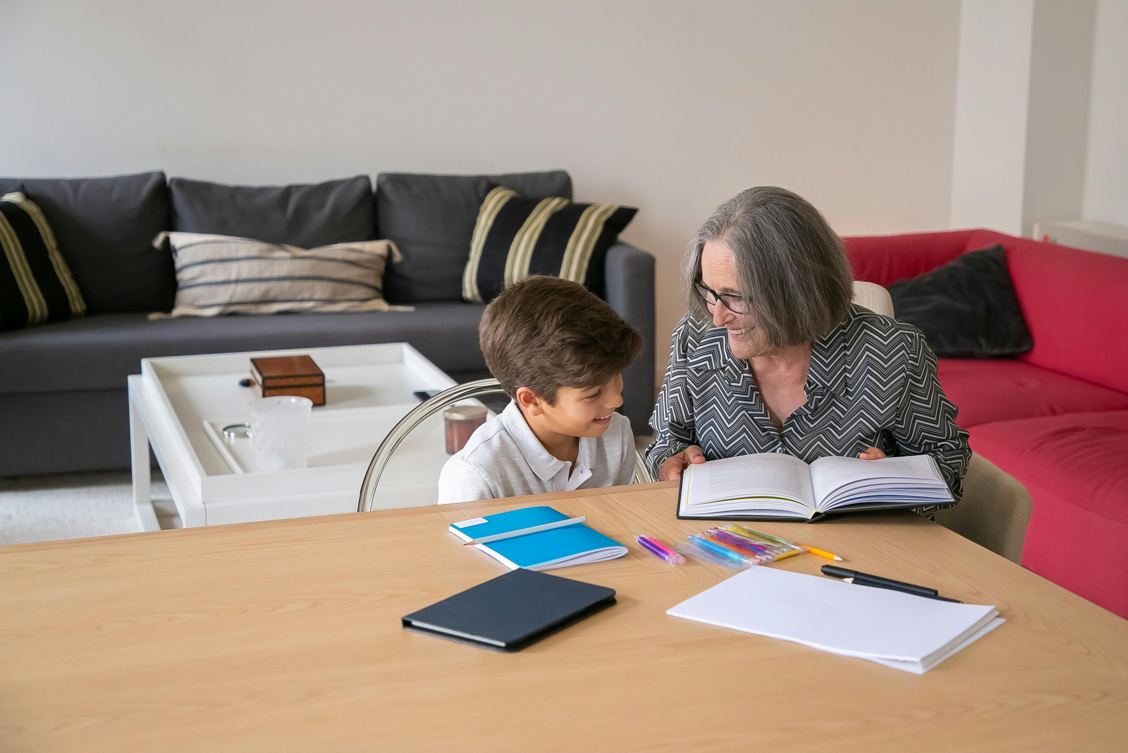 Grandmother Helping her Grandchildren with her Studies · Free Stock Photo