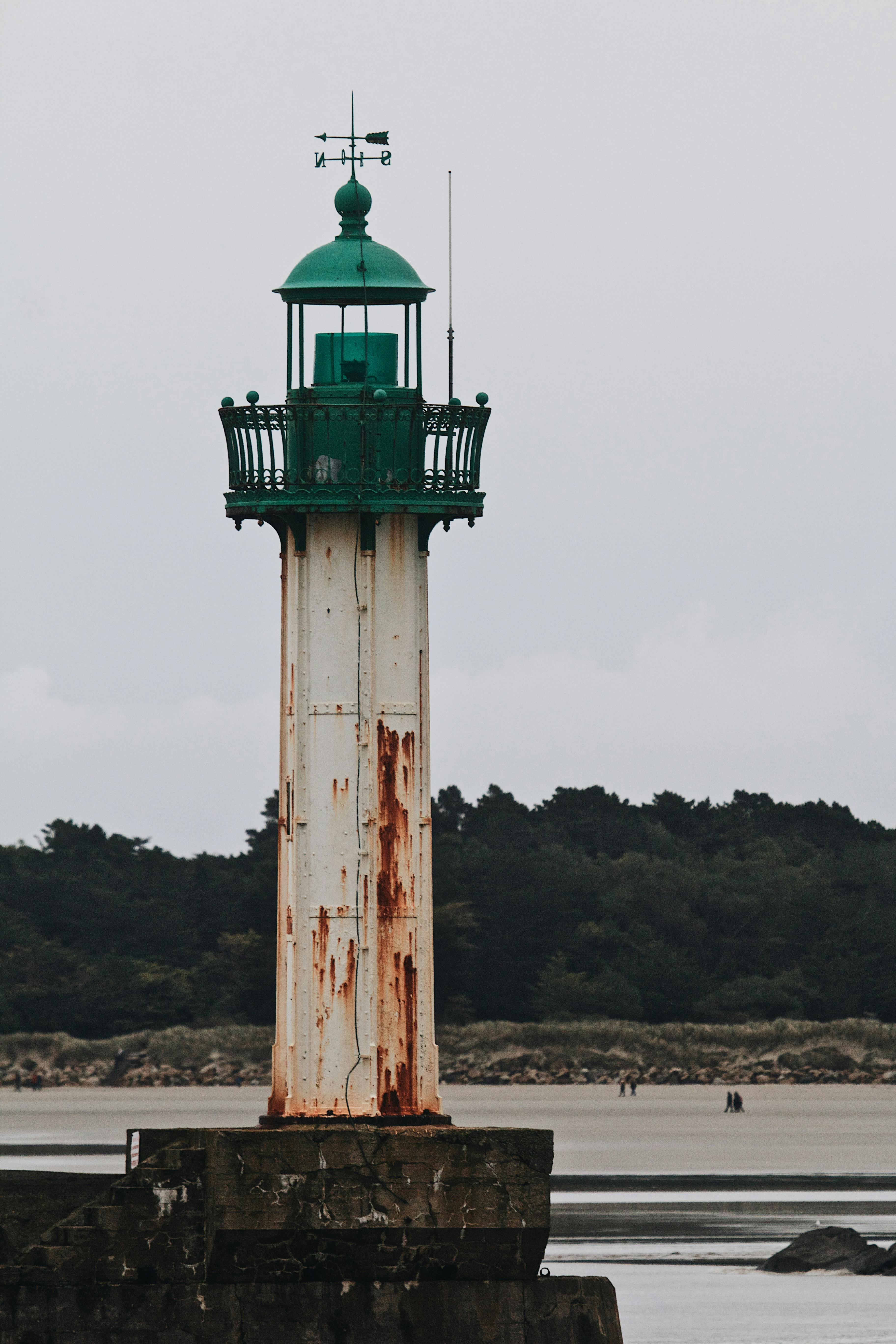 Photograph of a Lighthouse with Rust · Free Stock Photo