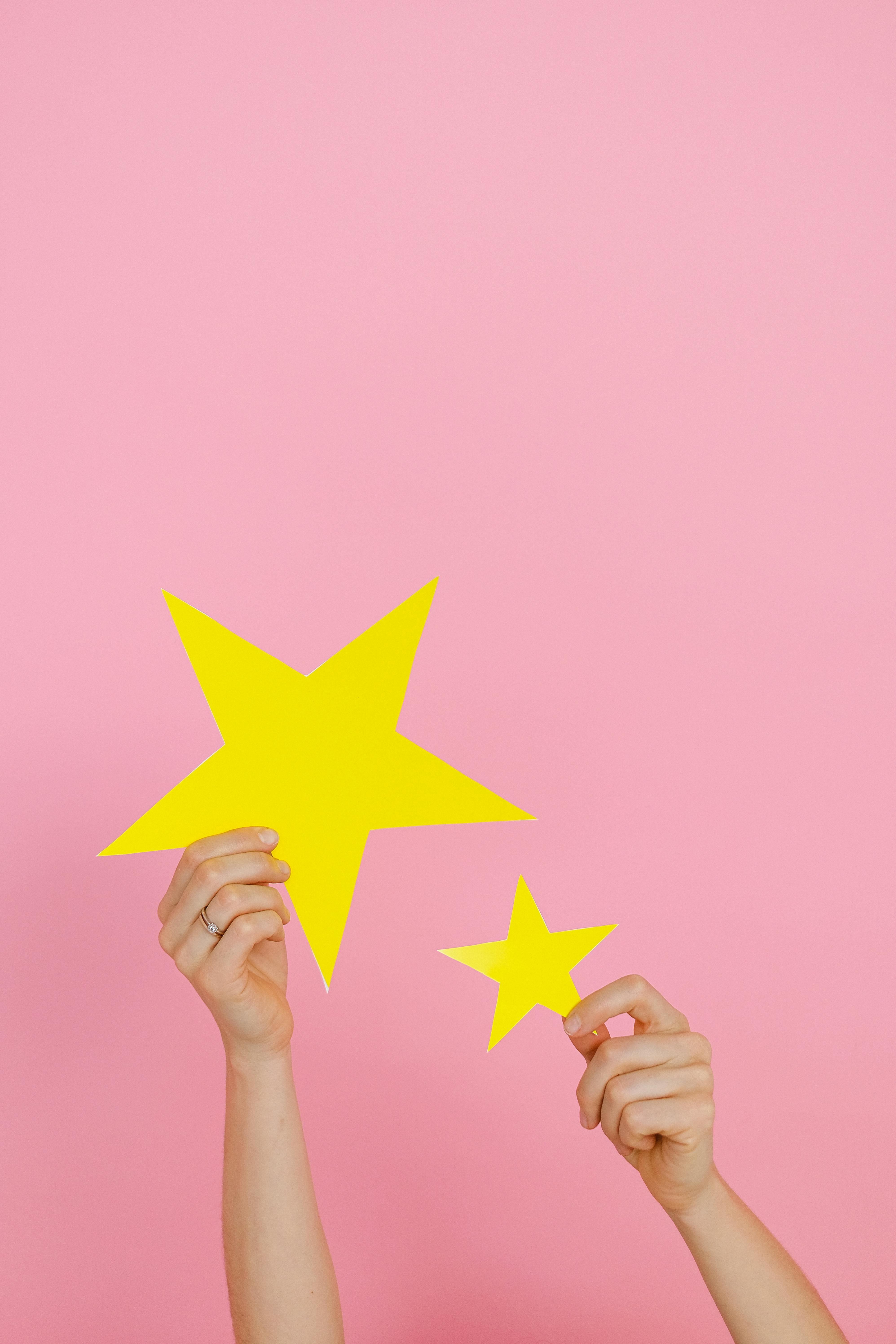 Close-Up Shot of a Person Holding Yellow Stars · Free Stock Photo