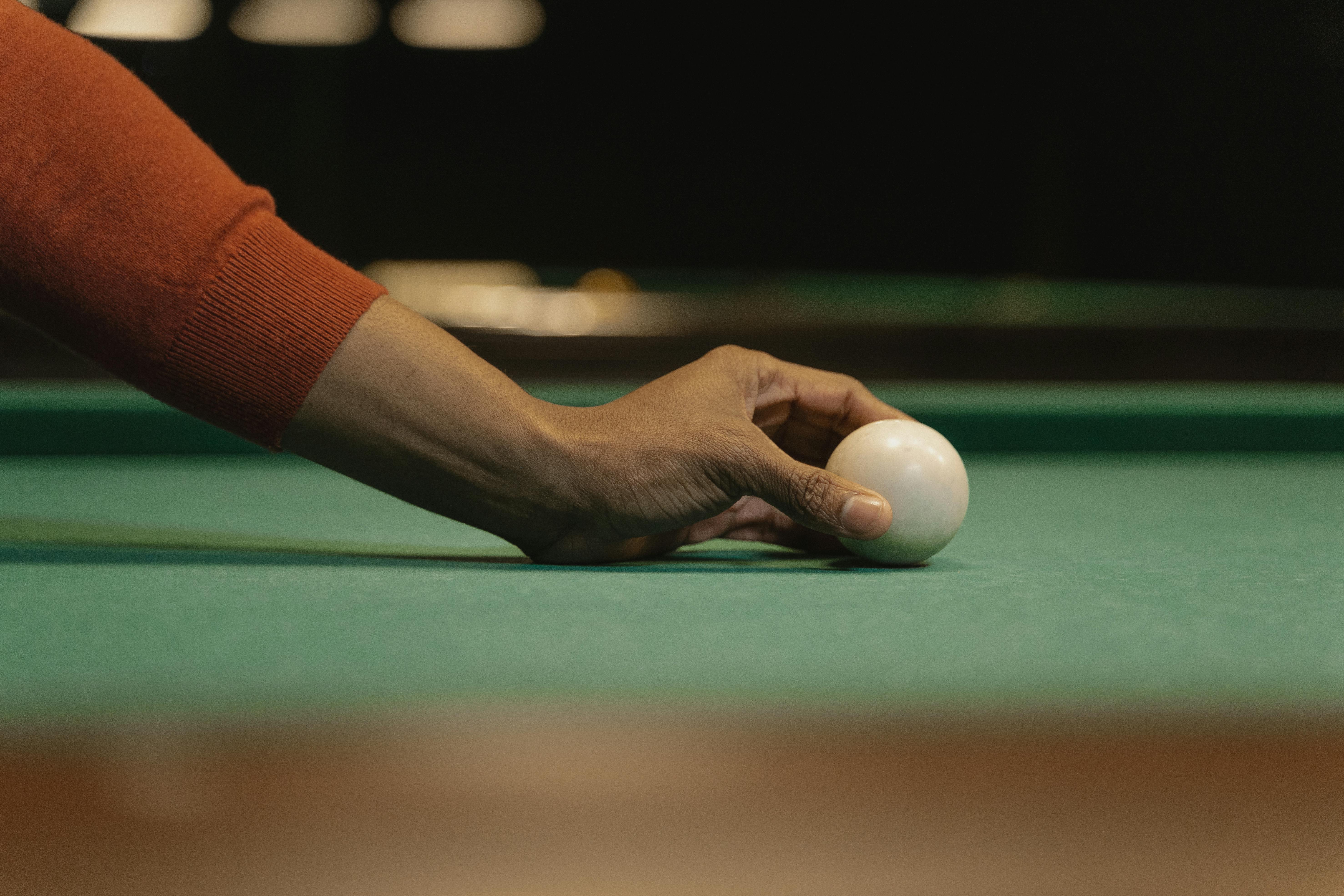 Person Holding a Cue Ball · Free Stock Photo