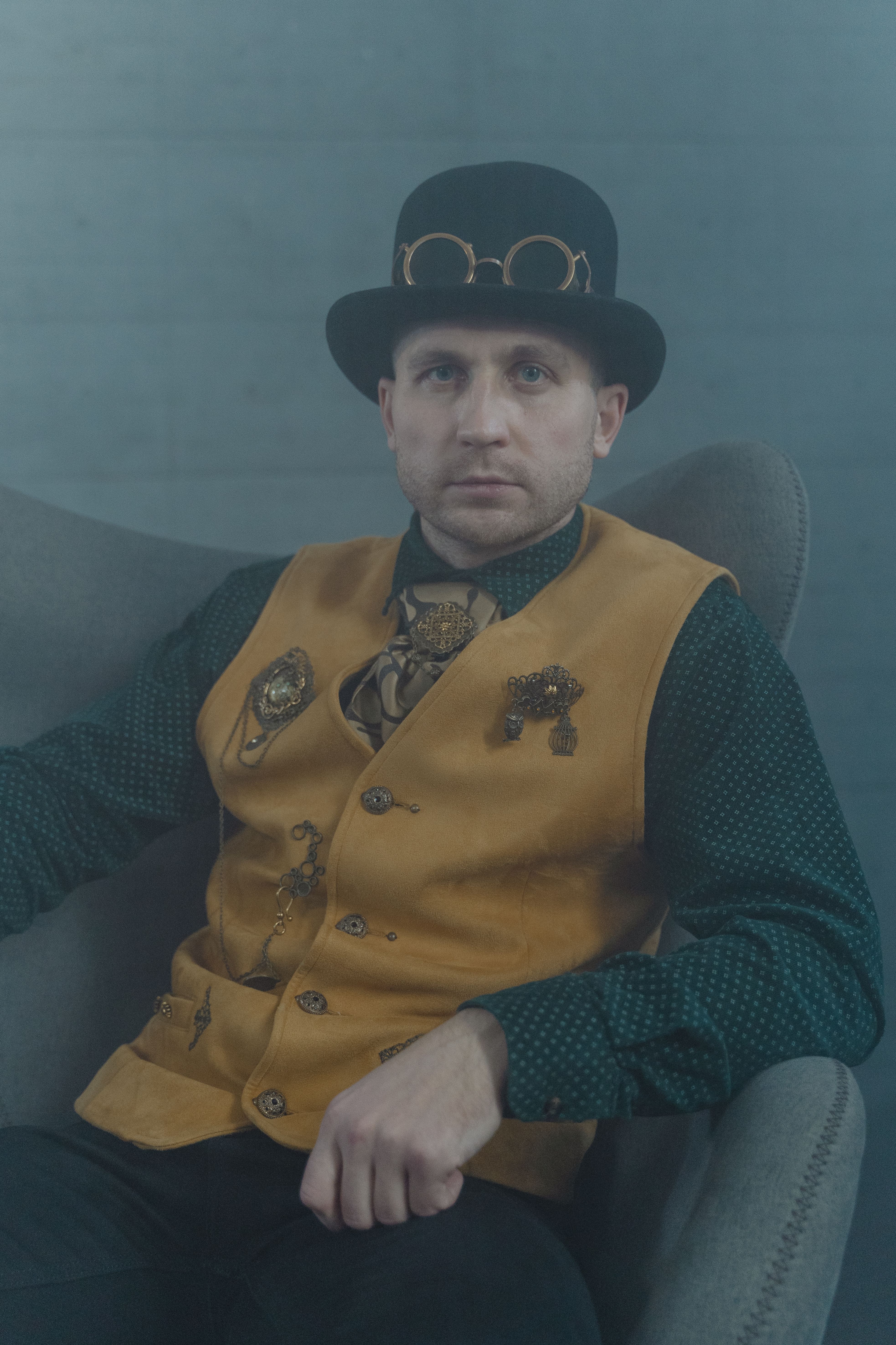 A Man in a Hat Sitting on Chair · Free Stock Photo