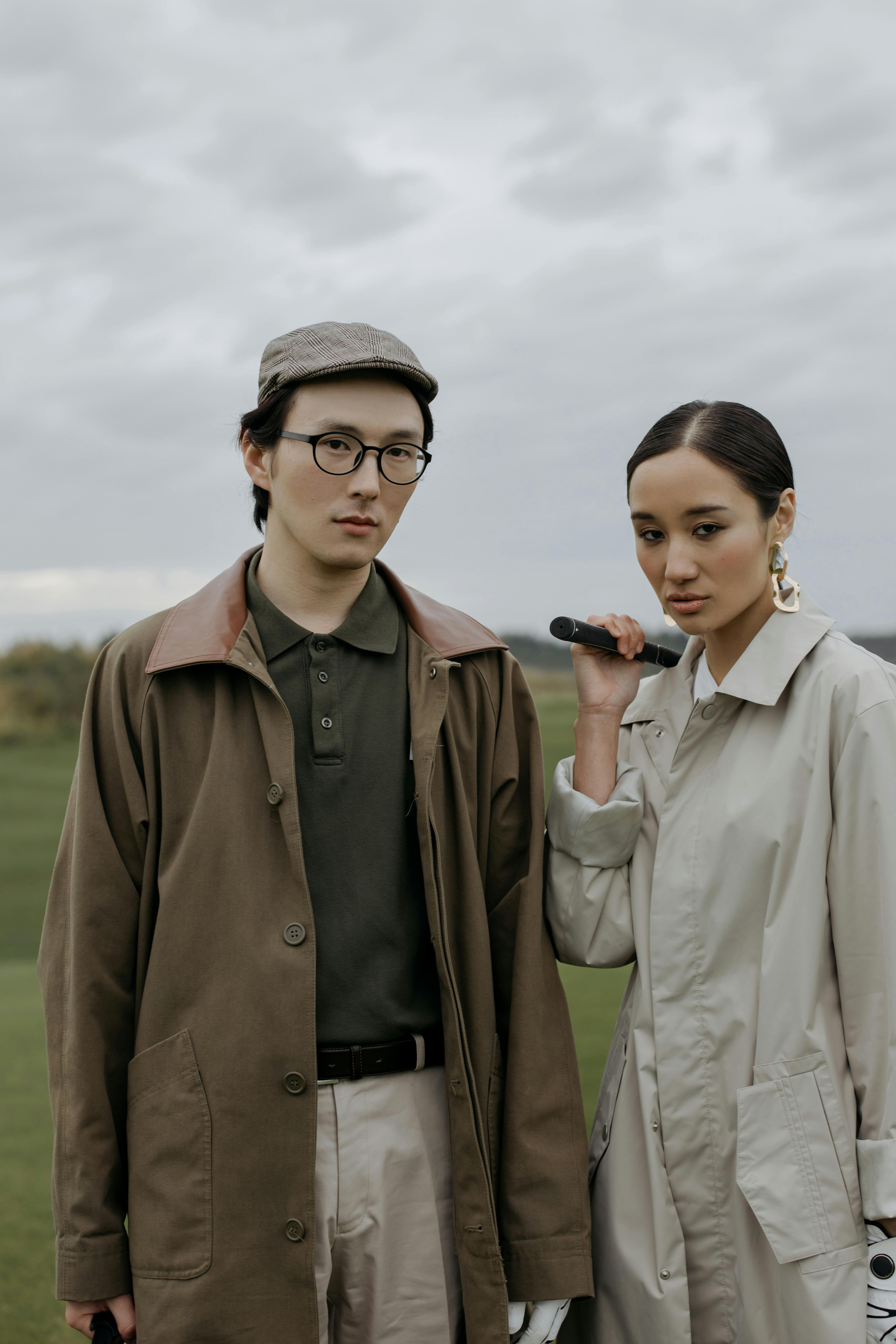 Man and Woman Wearing Long Coat · Free Stock Photo