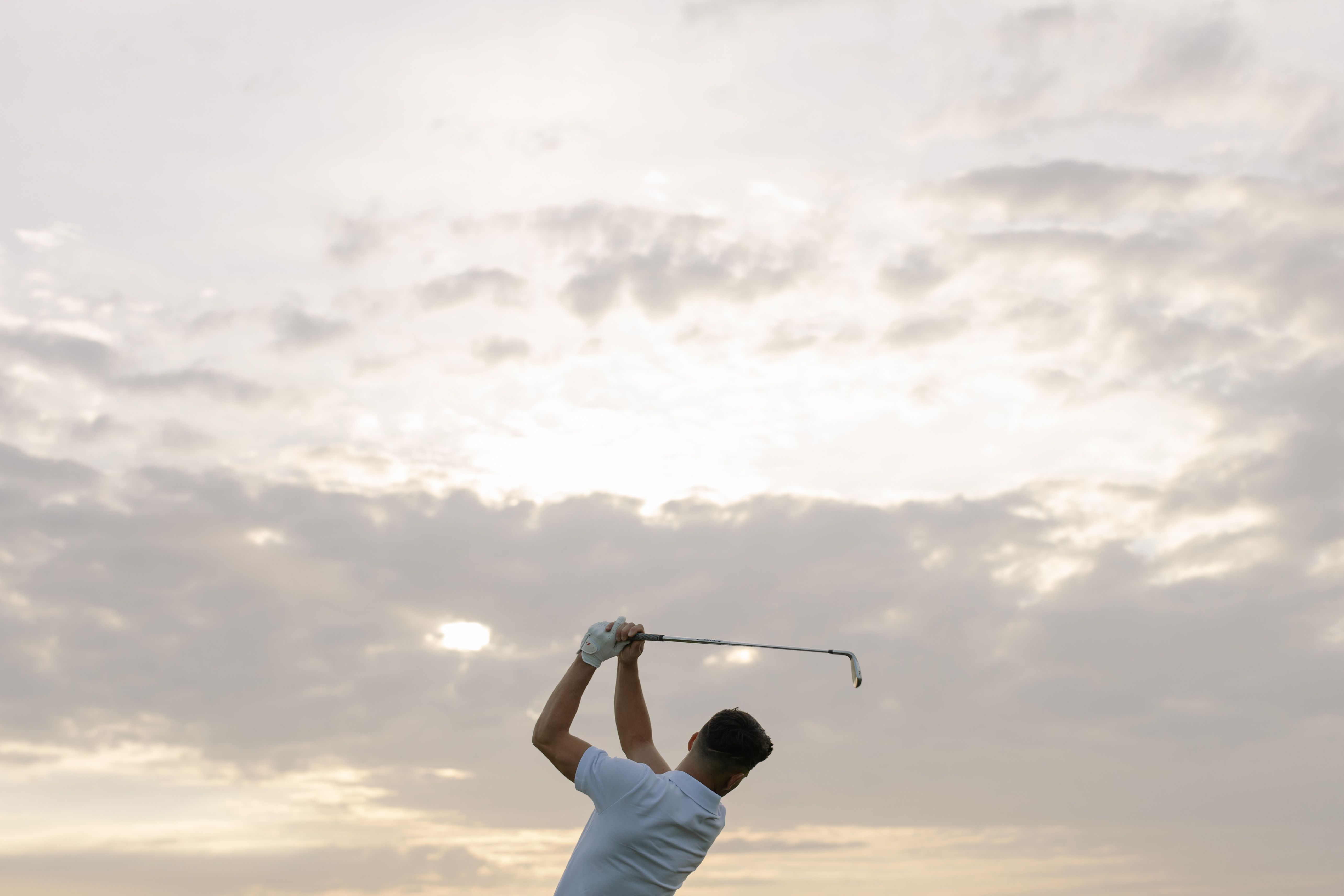Silhouette of Man Playing Golf during Sunset · Free Stock Photo