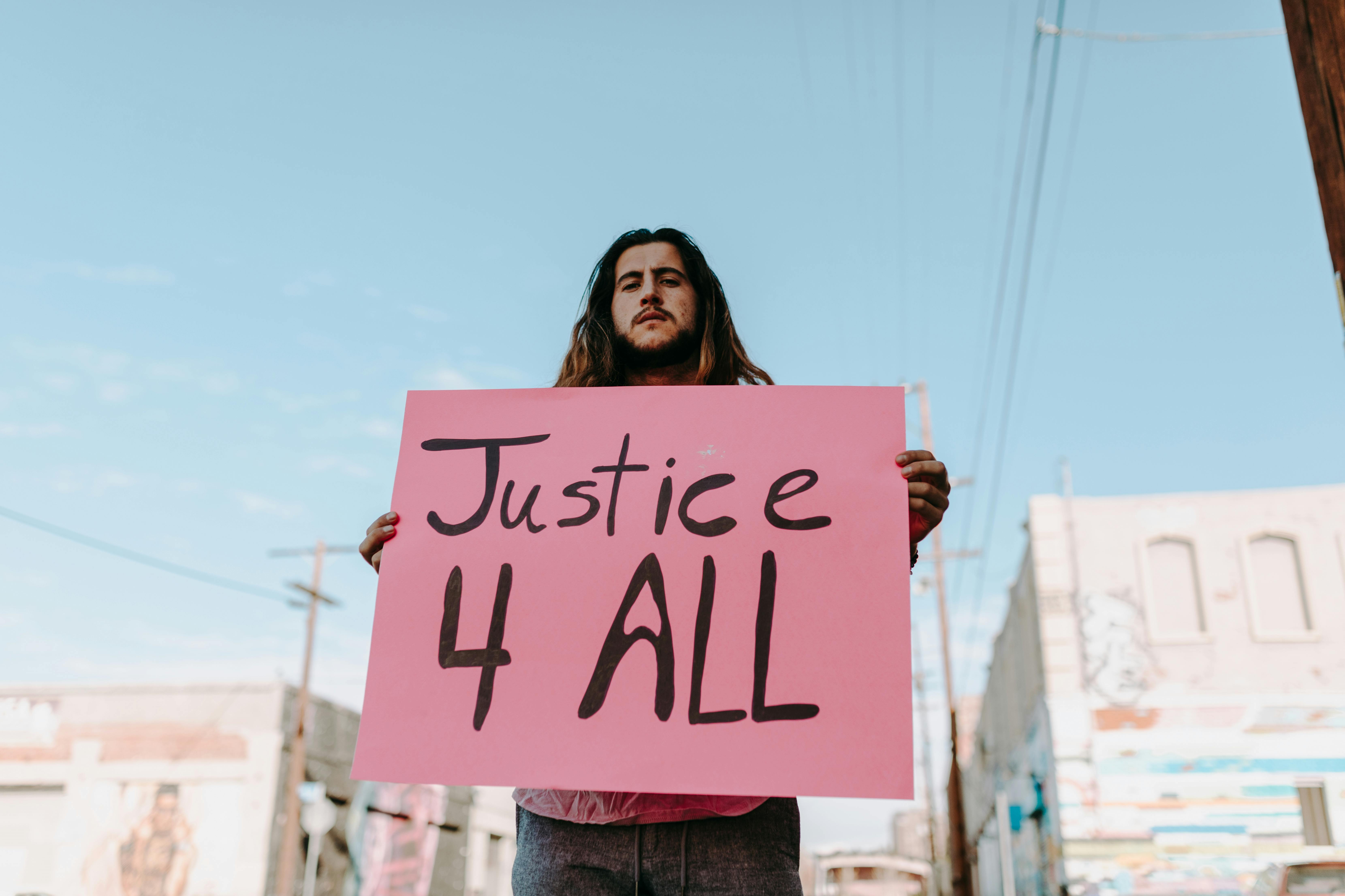 Man Holding a Poster on Equal Rights · Free Stock Photo
