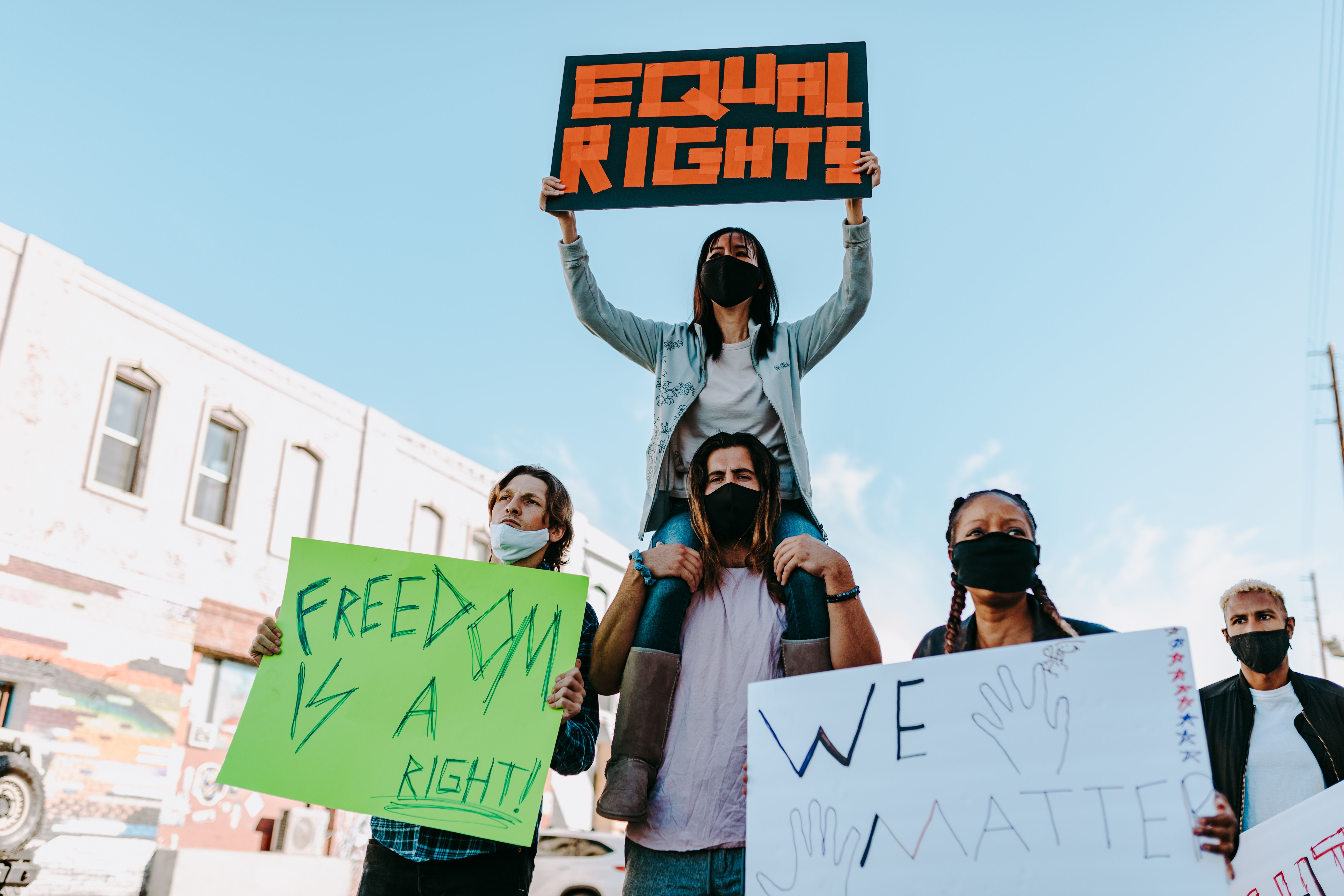 People Carrying a Banner · Free Stock Photo