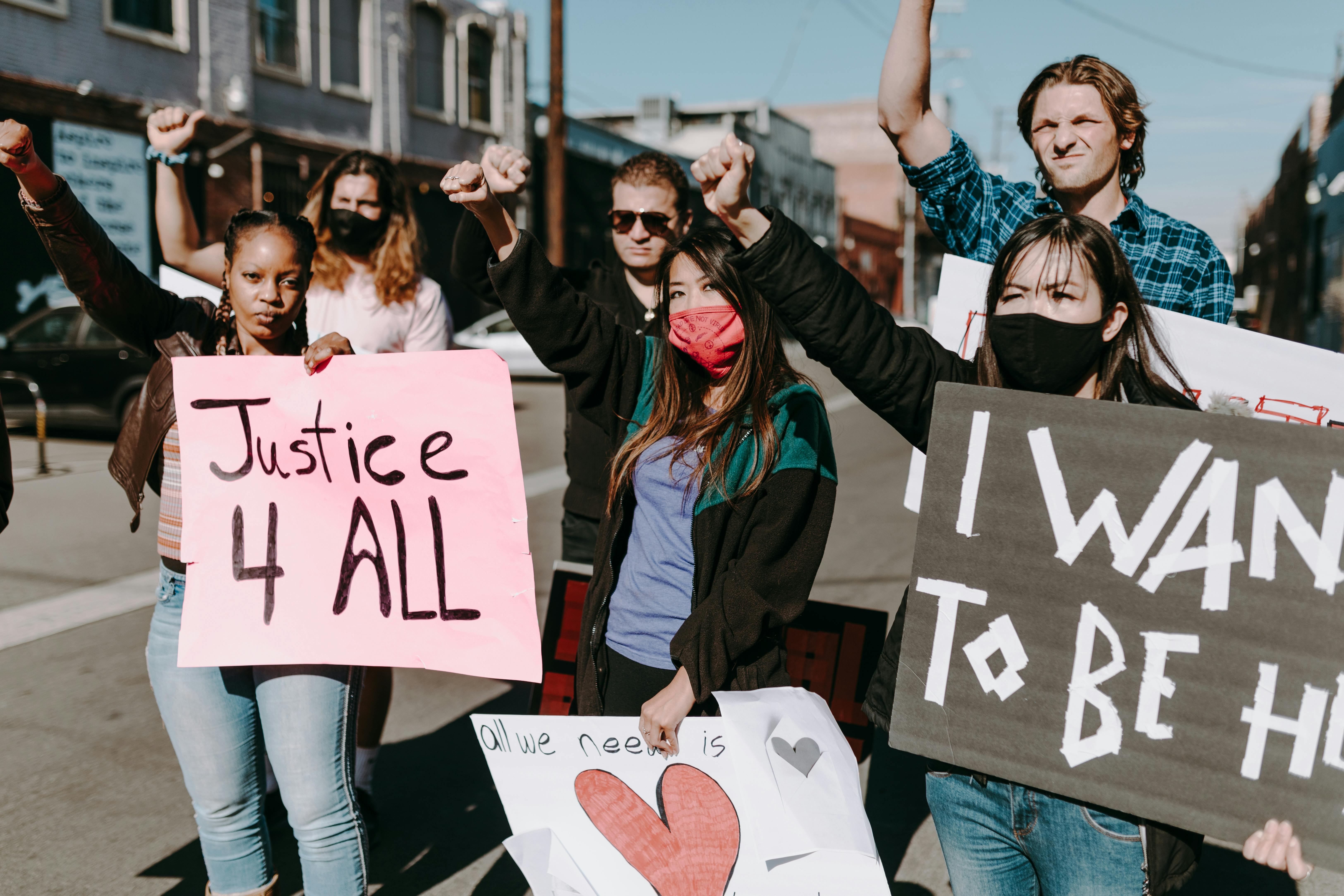 A People Holding at Each Other Doing Protest · Free Stock Photo