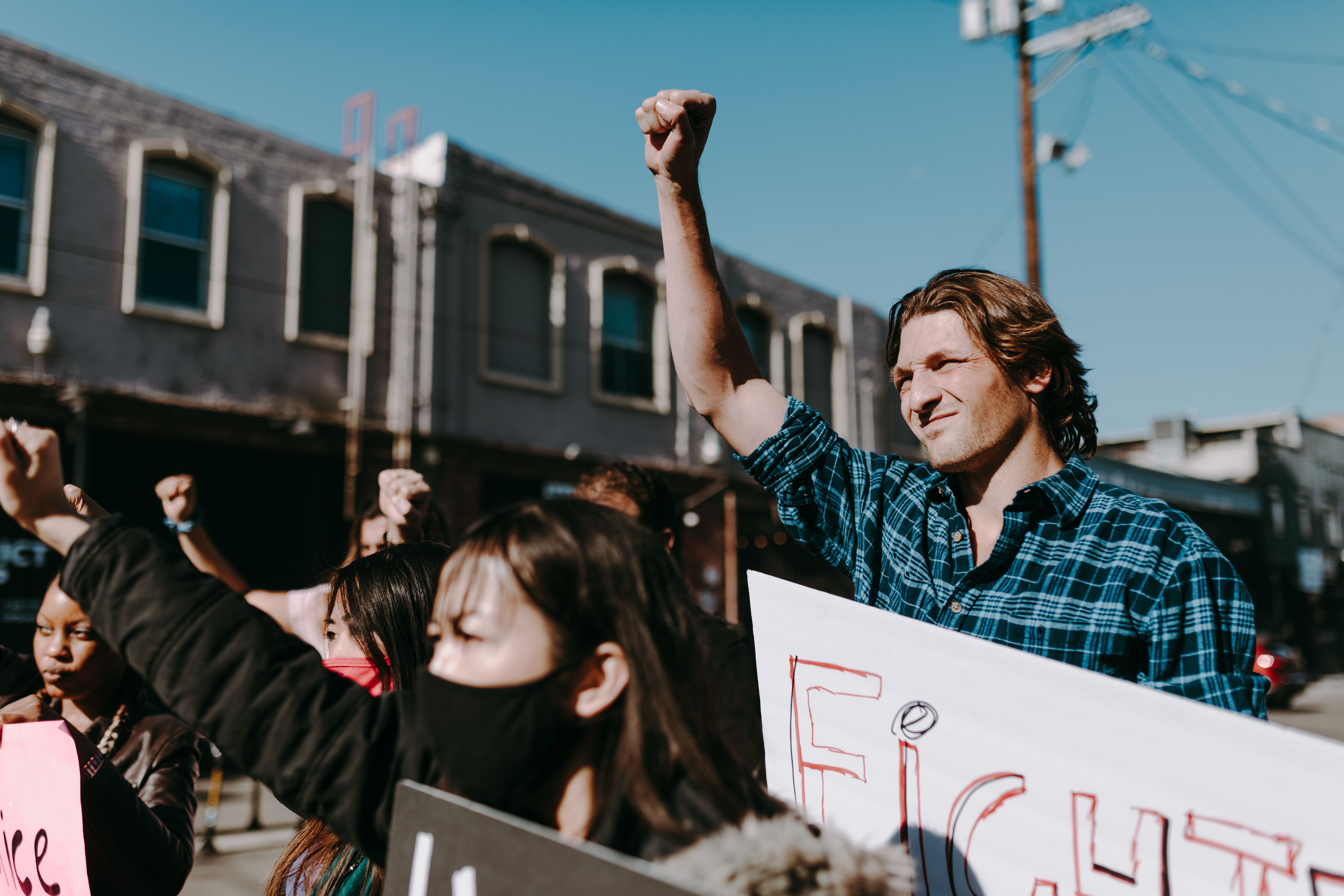 People Carrying a Banner · Free Stock Photo