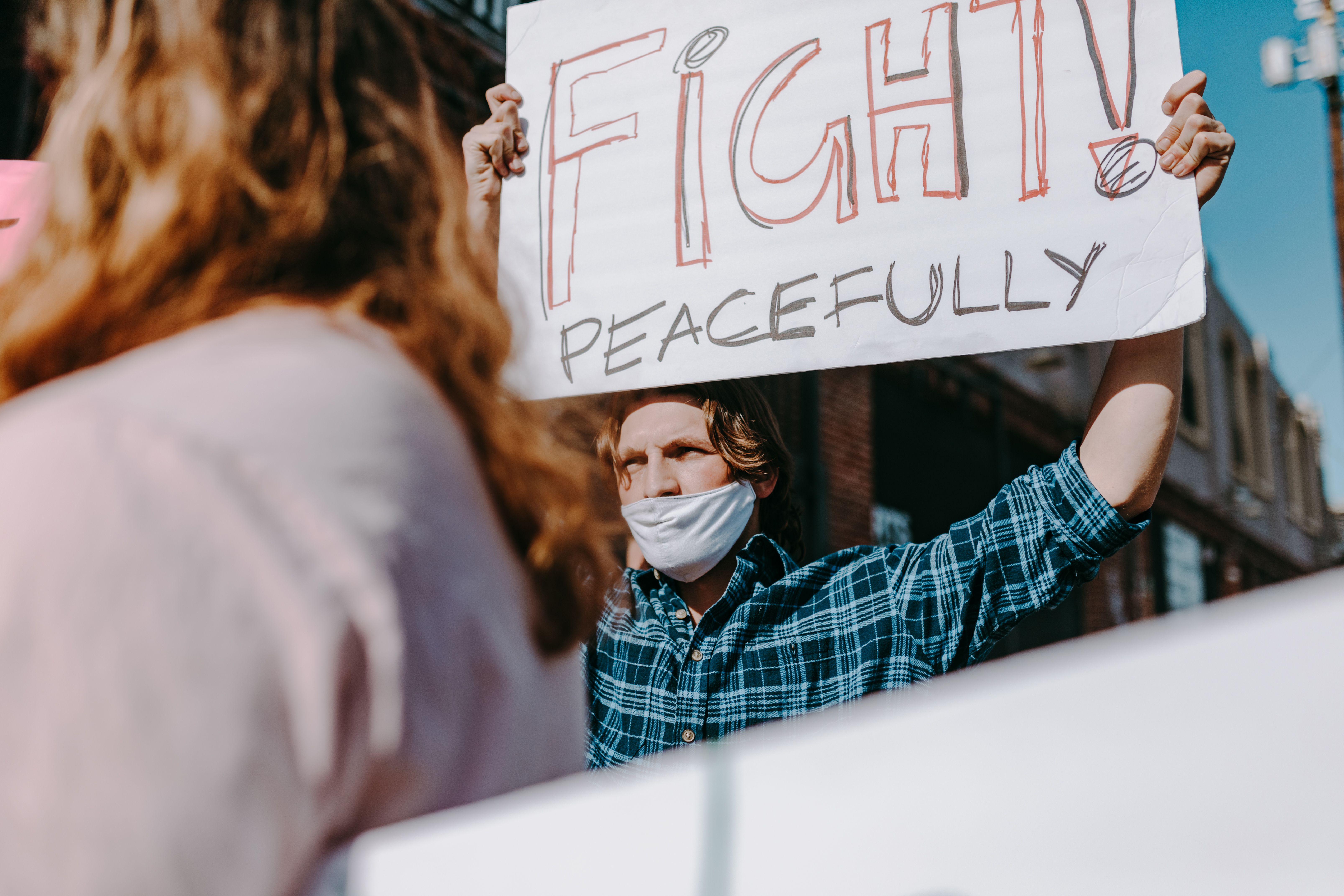 People Carrying a Banner · Free Stock Photo