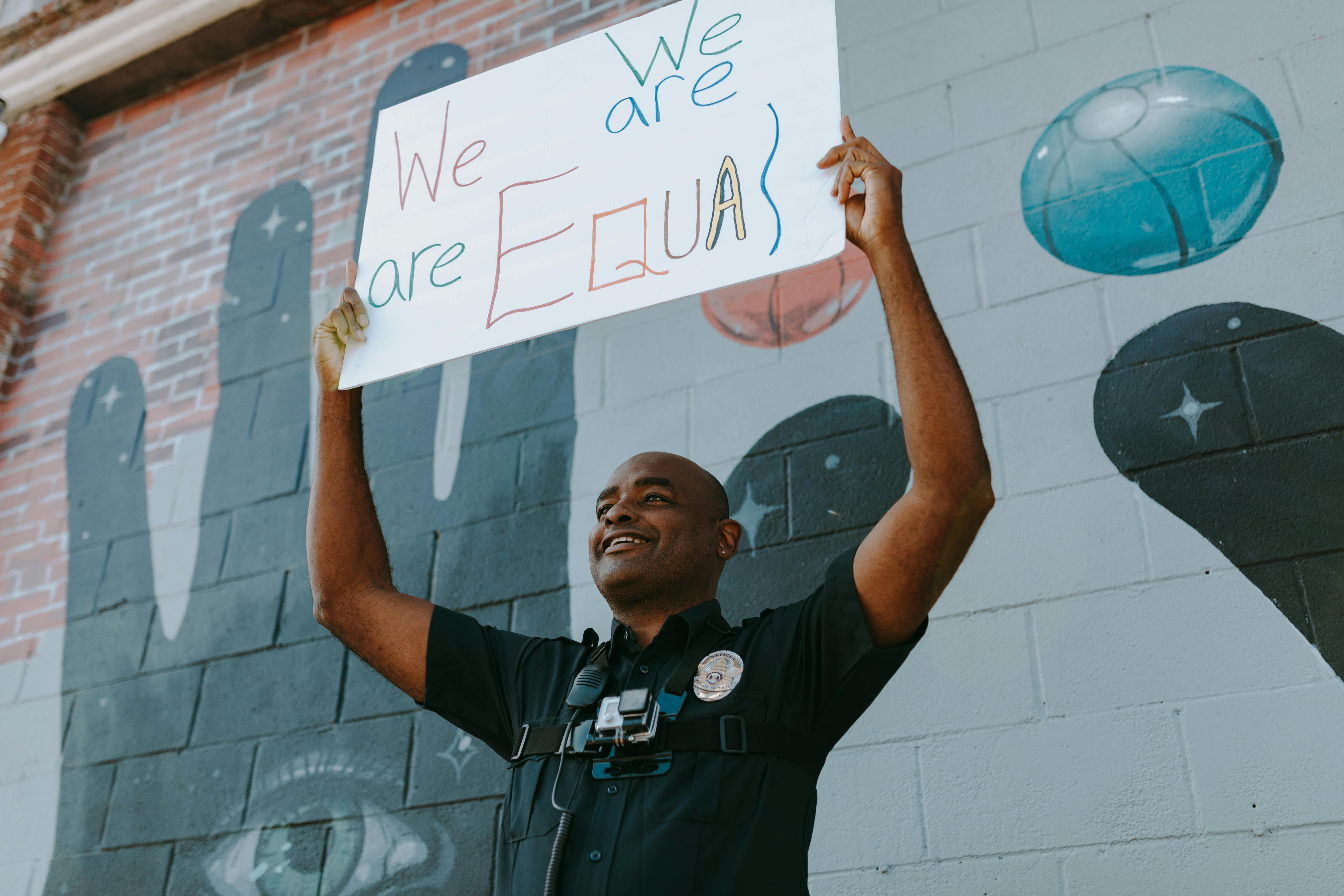 Young Man Standing in Street with Void Cardboard Banner and Calling ...