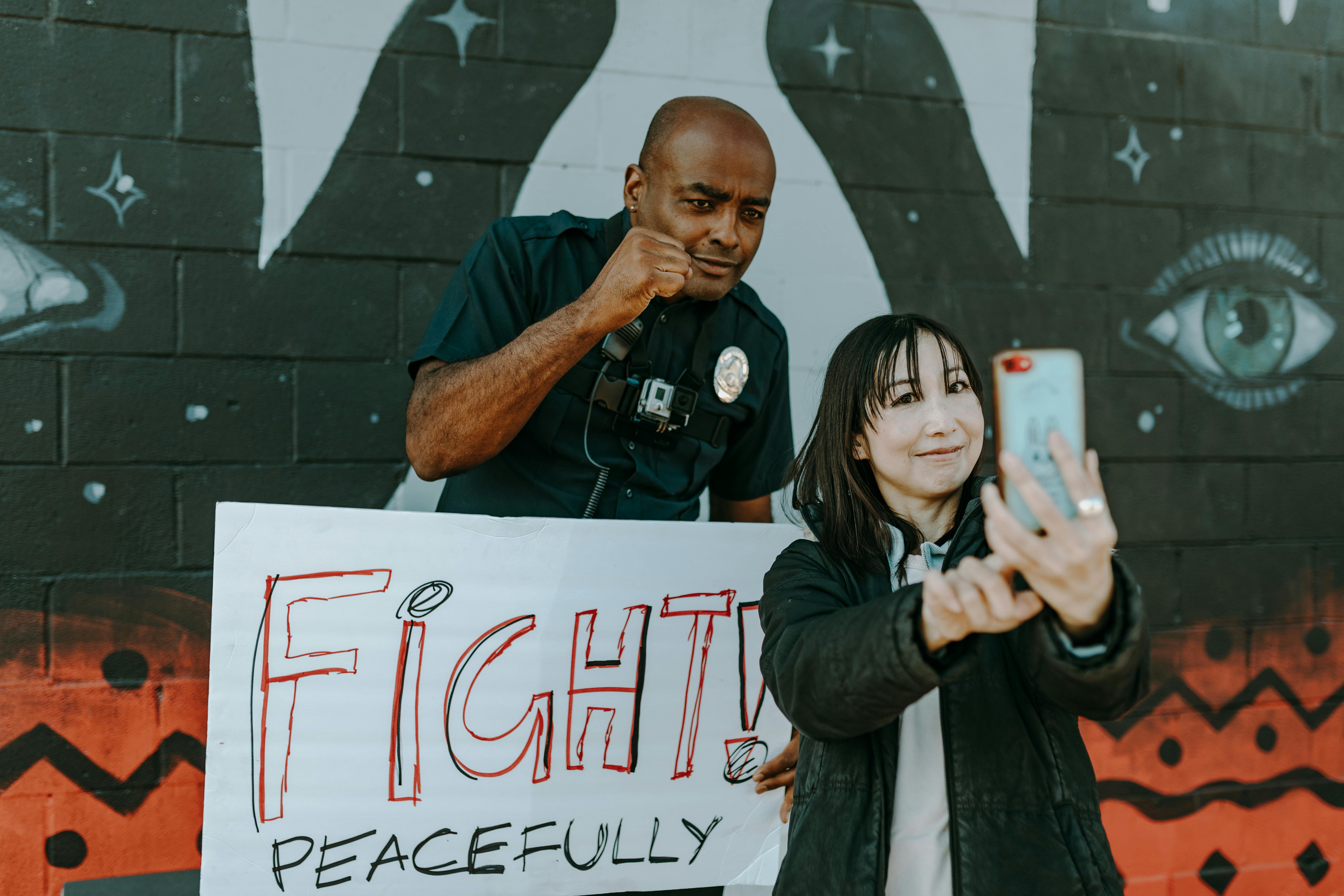 A Woman Having a Selfie with the Policeman · Free Stock Photo