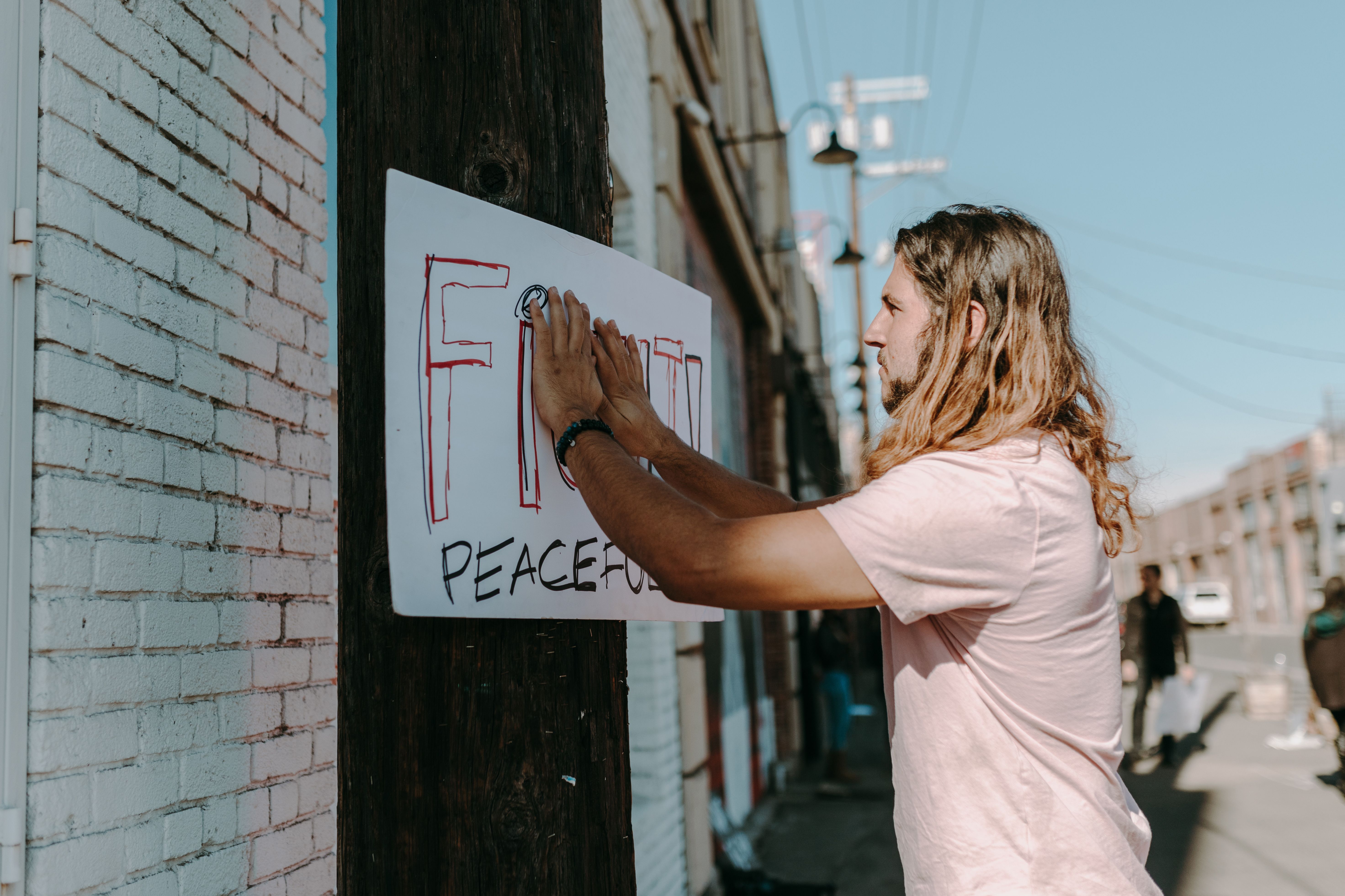 People Carrying a Banner · Free Stock Photo