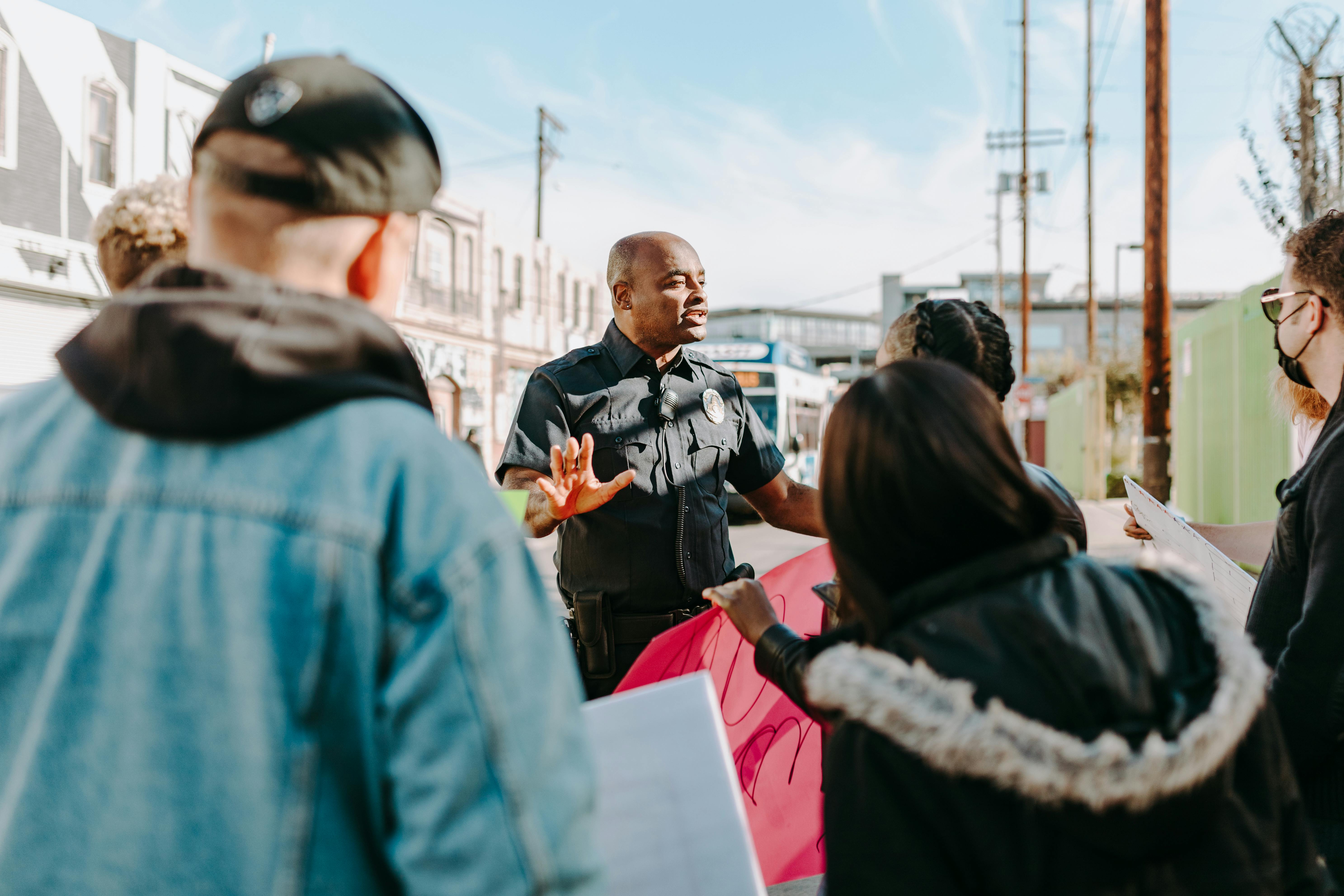 A Police Talking the Protesters · Free Stock Photo
