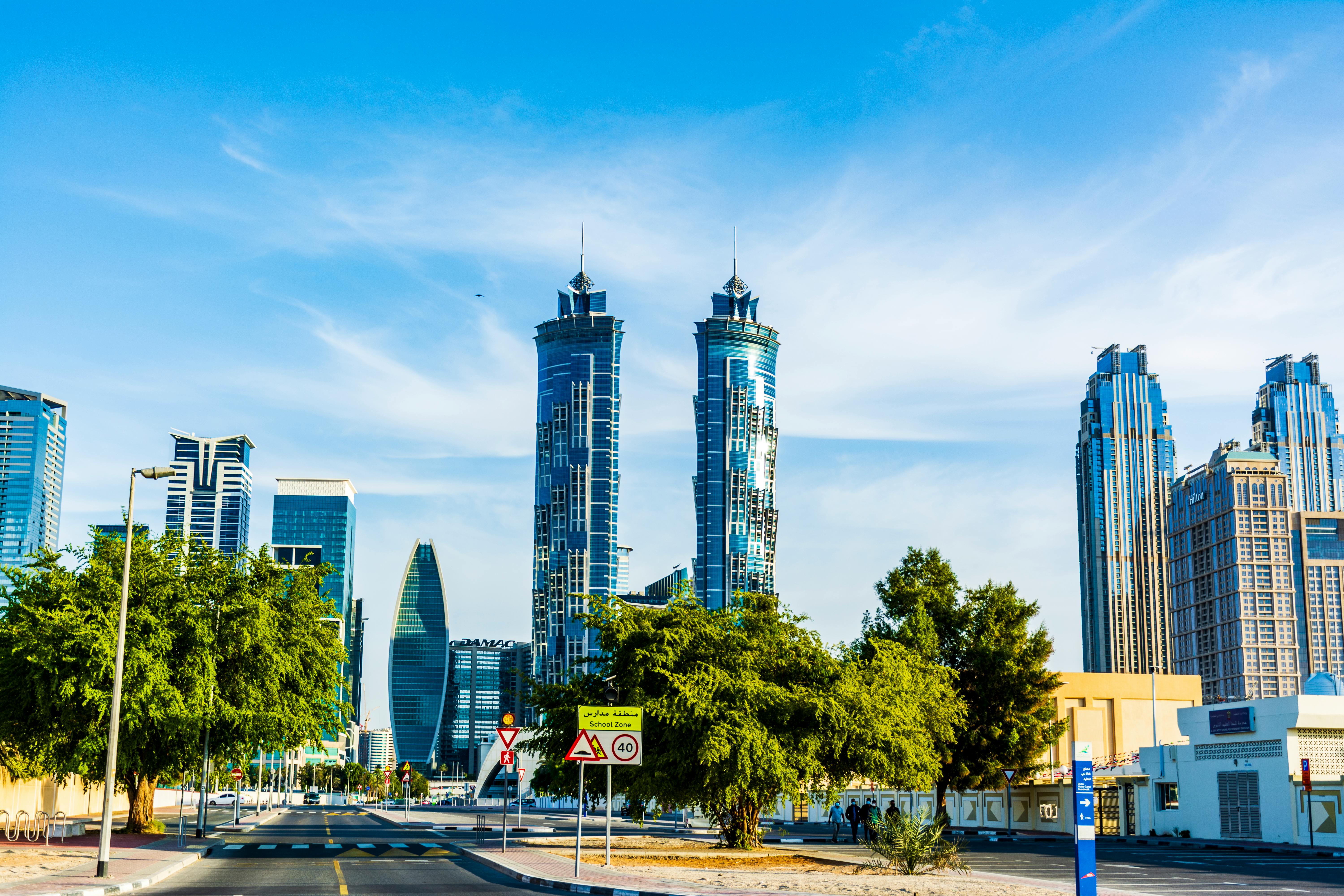 White and Blue High Rise Buildings · Free Stock Photo