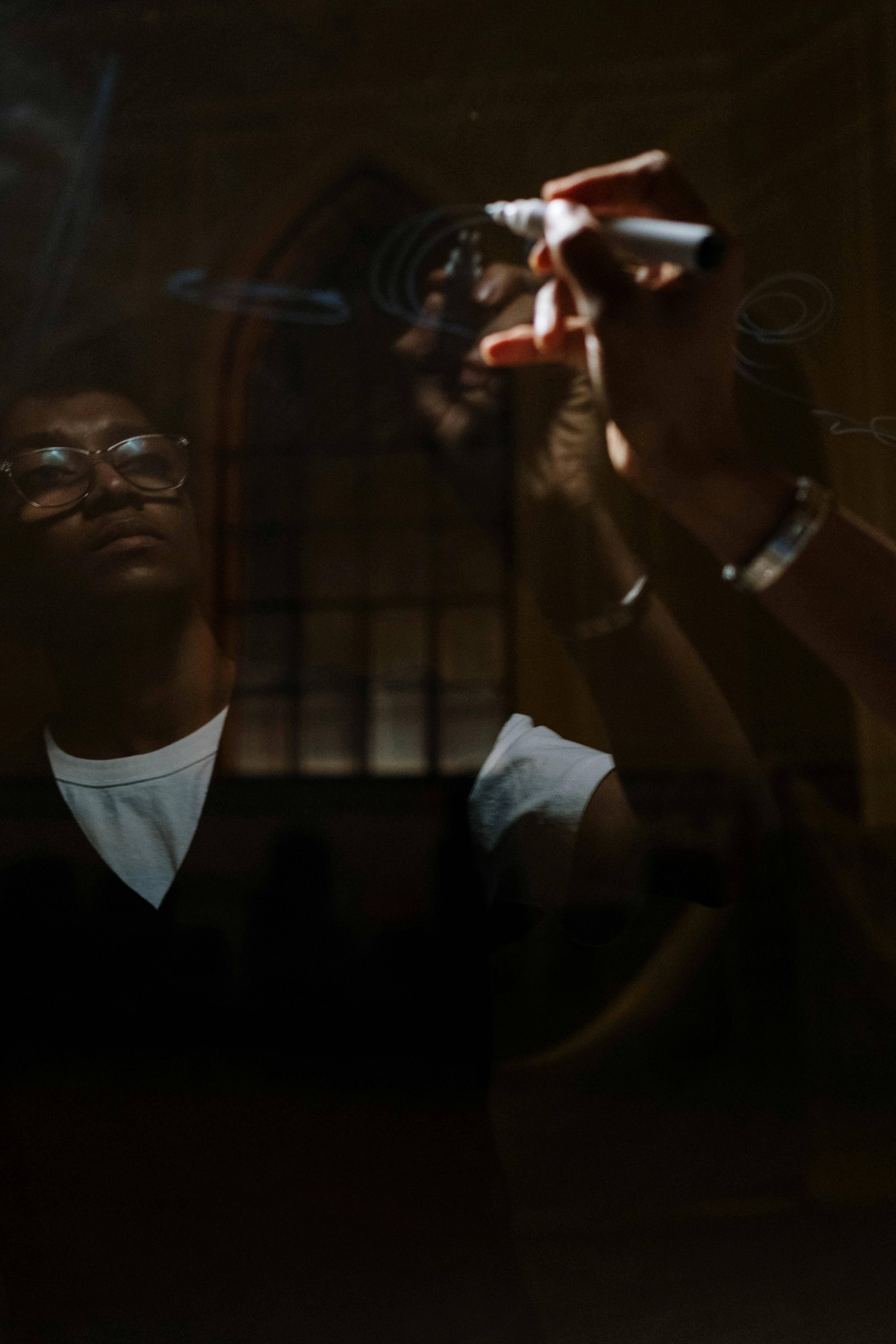 A Man Writing on a Mirror · Free Stock Photo