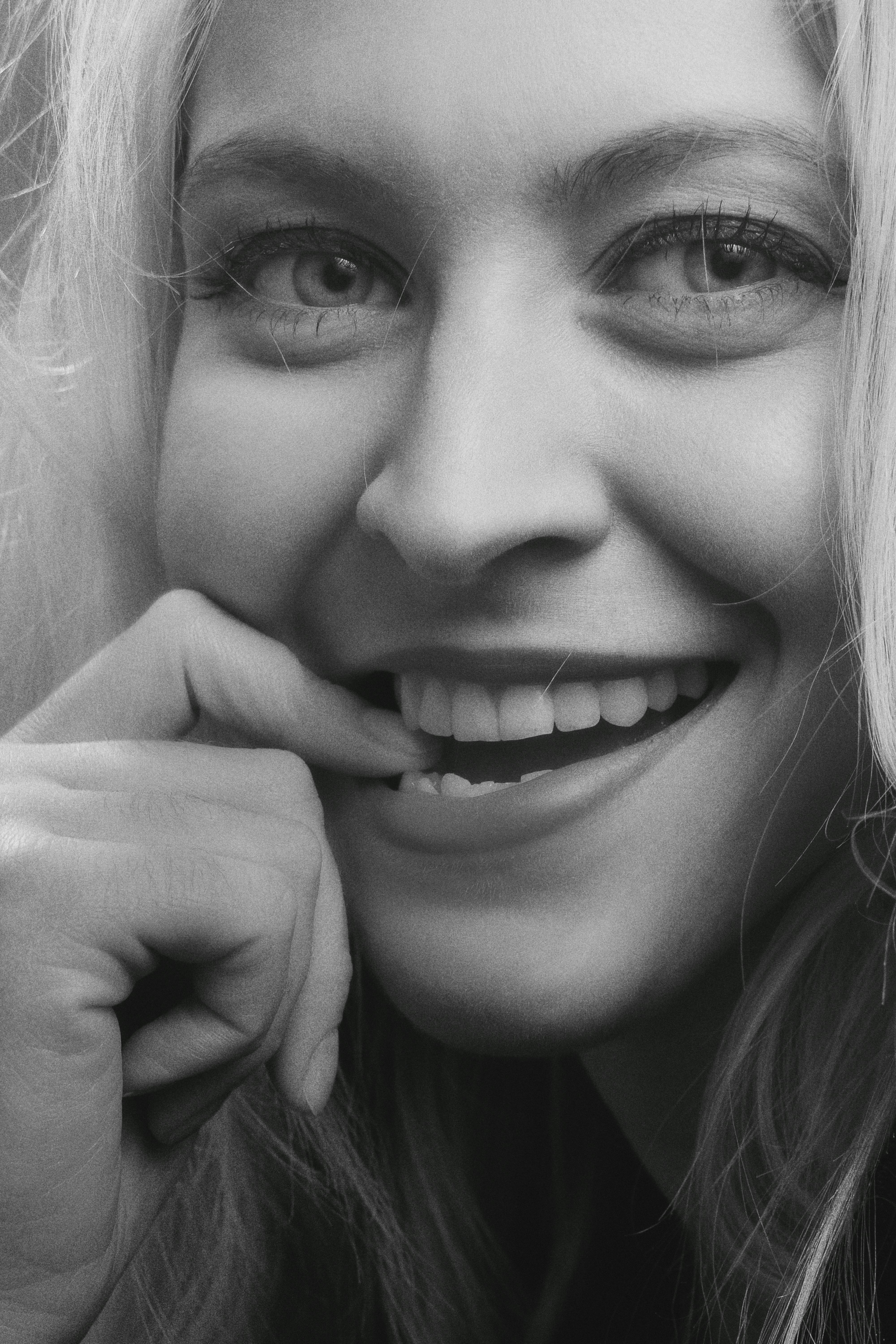 A Woman Biting her Finger · Free Stock Photo