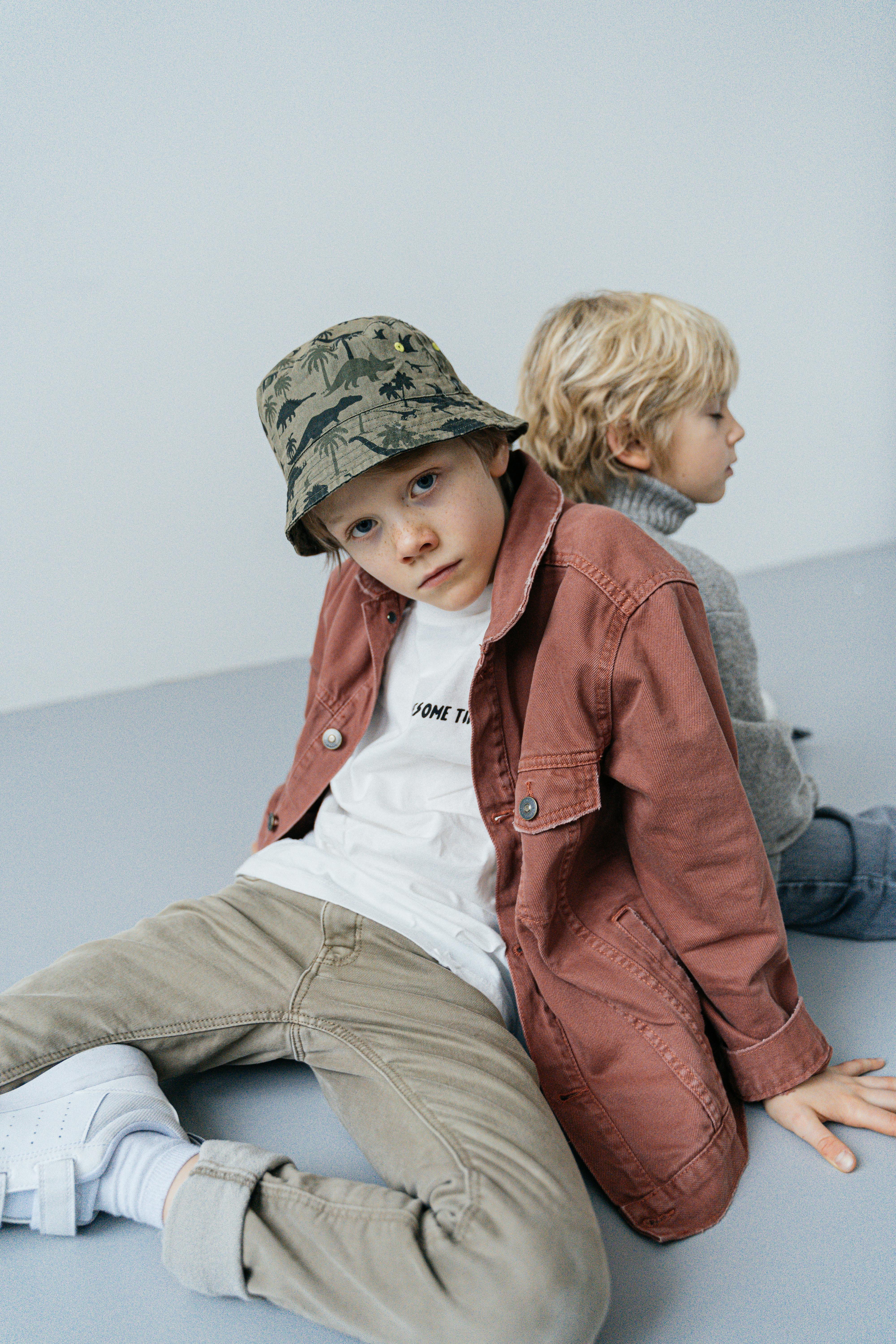 Boy in a Jacket Sitting on the Floor · Free Stock Photo