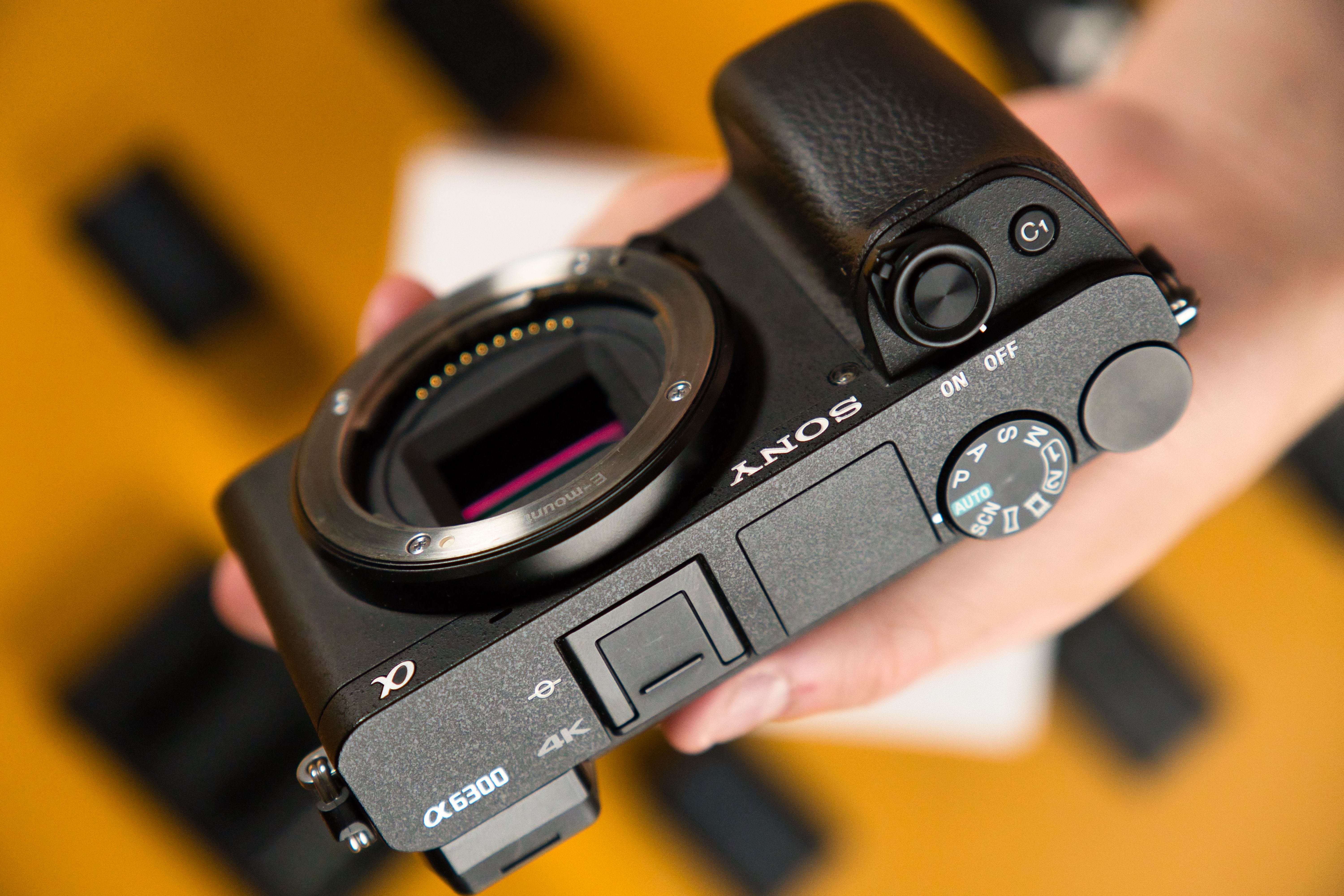 Black Sony Dslr Camera on Black Surface · Free Stock Photo