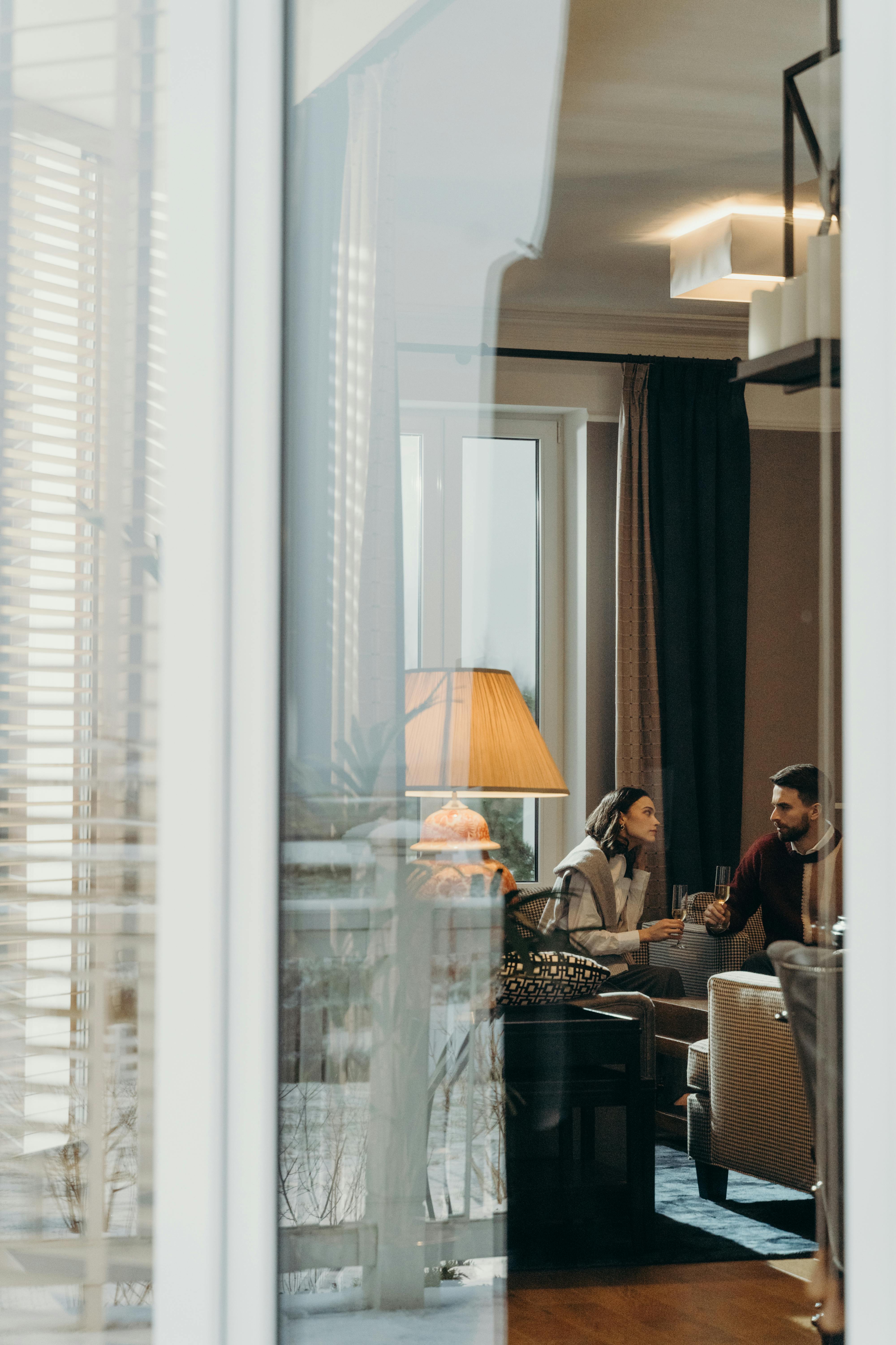 Couple Together behind House Window · Free Stock Photo