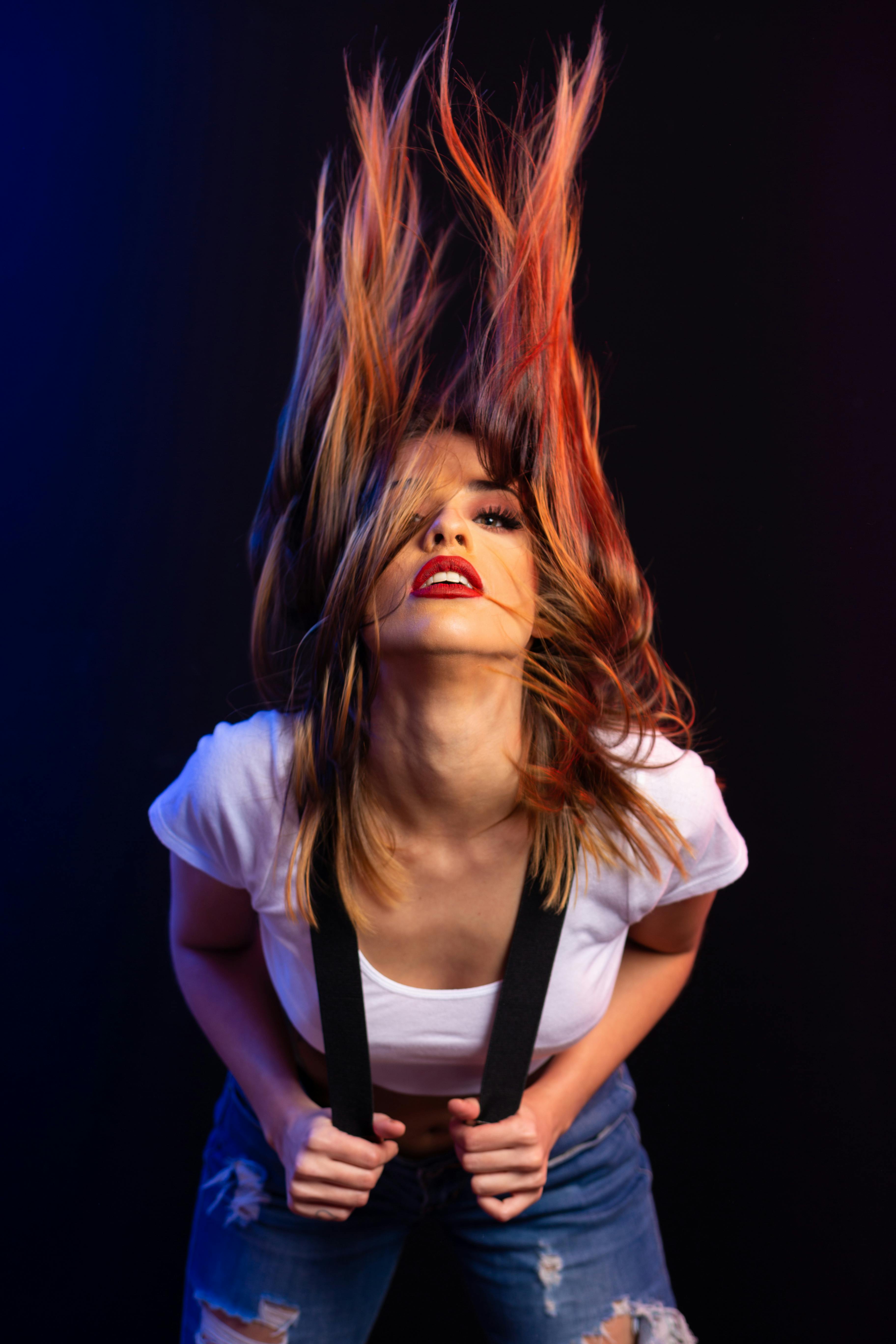 A Woman Doing a Hair Flip · Free Stock Photo