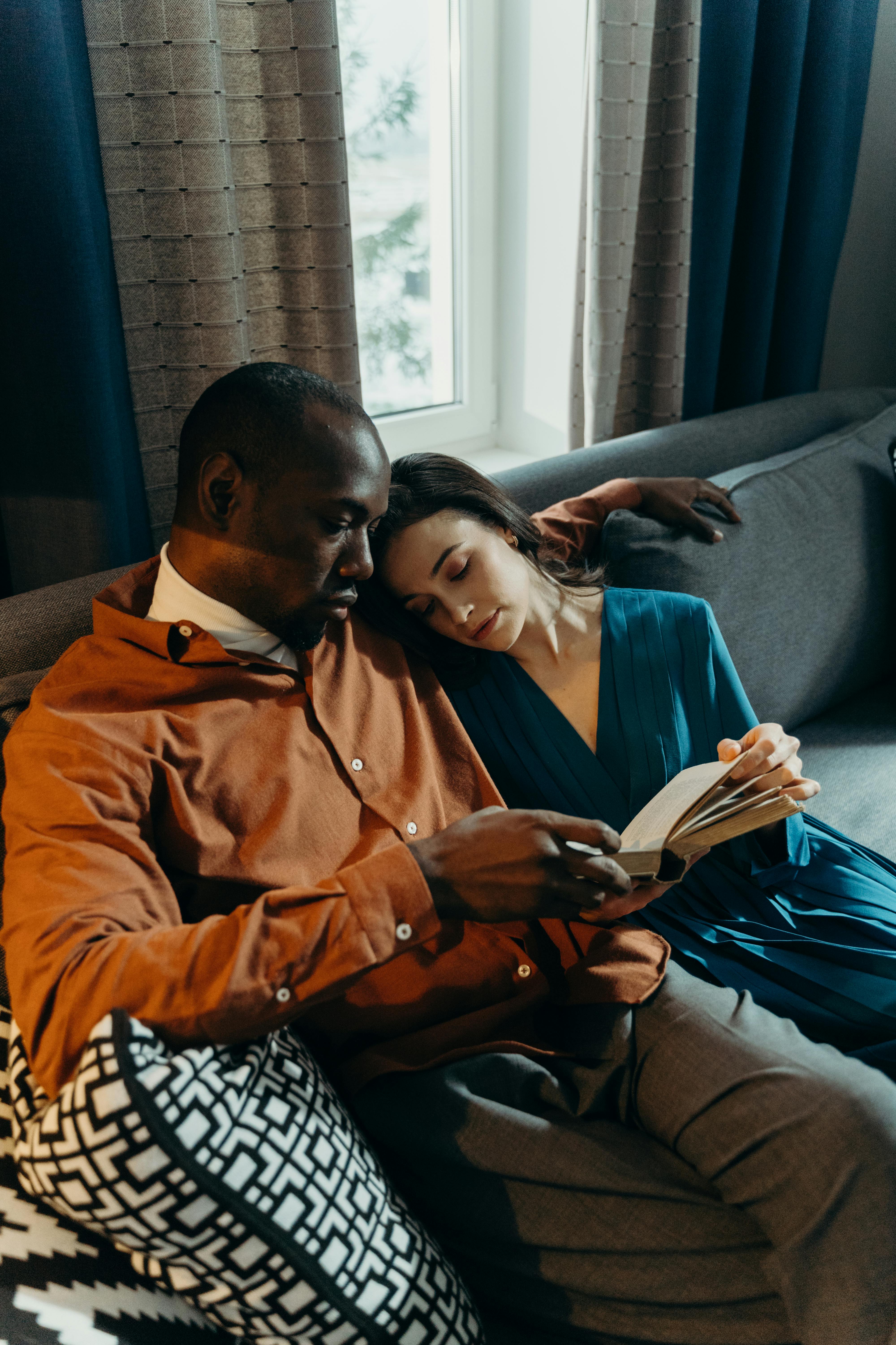 A Couple Reading a Book Together · Free Stock Photo