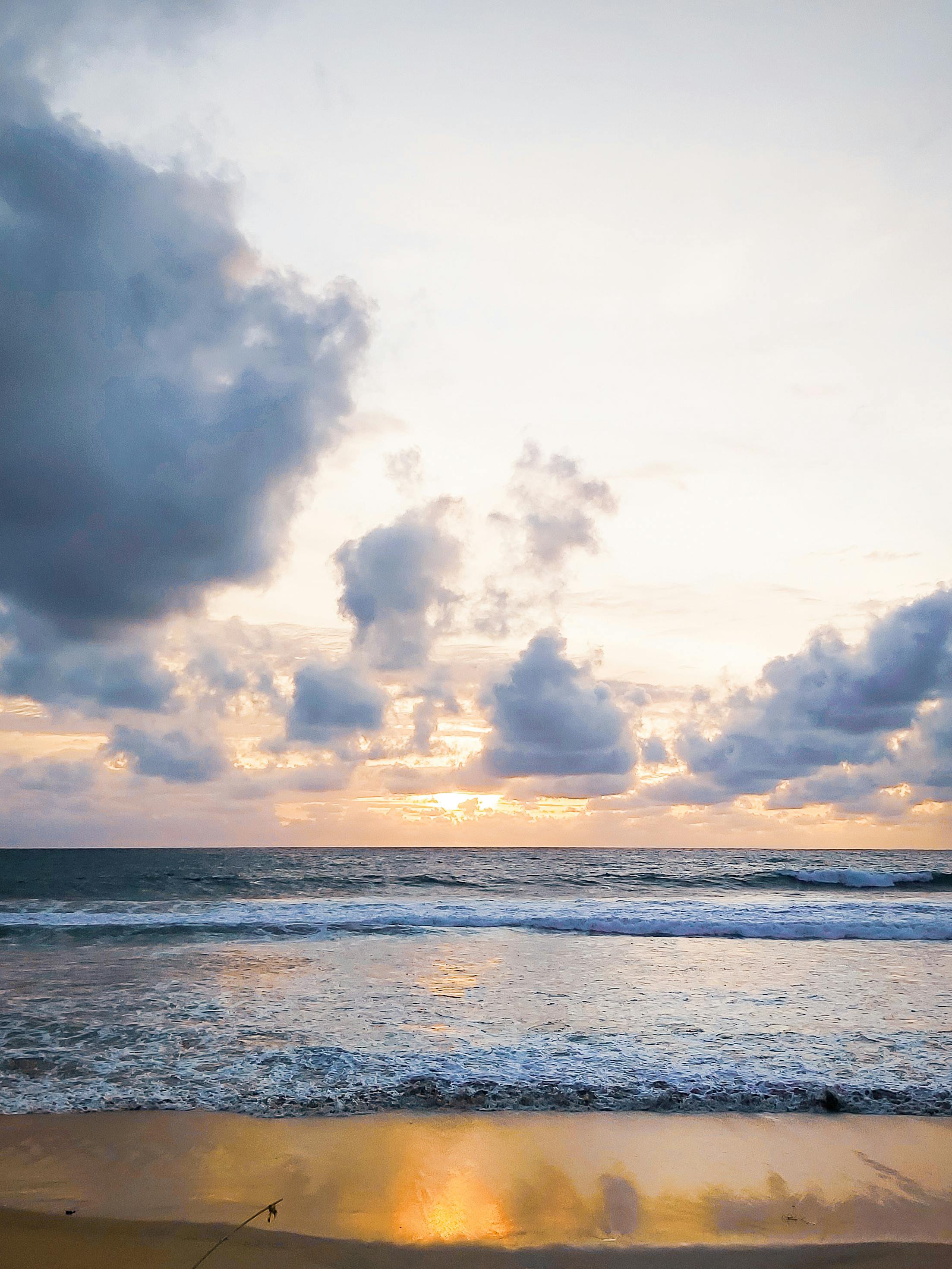 Scenic View Of Ocean During Dawn · Free Stock Photo