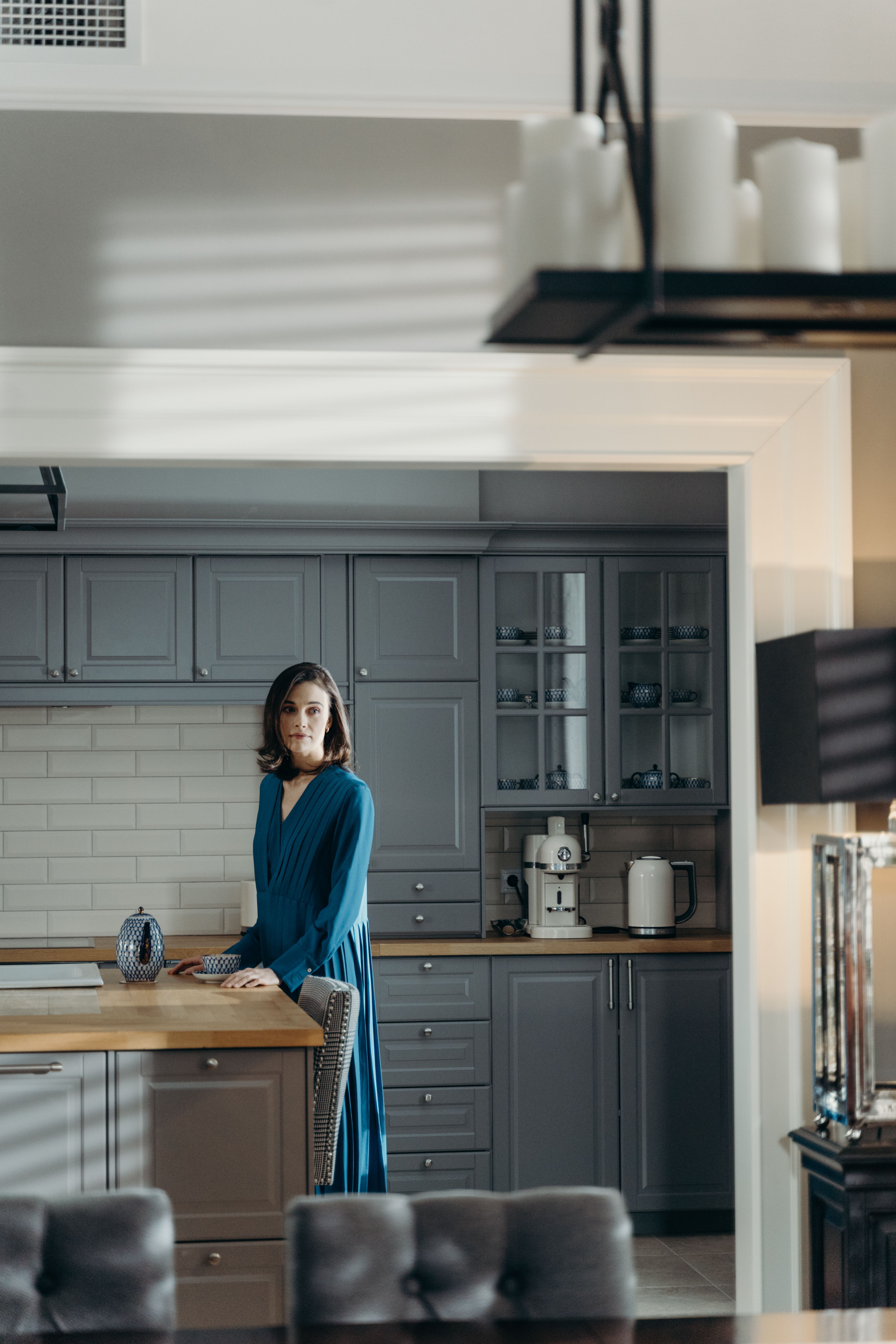 A Woman Wearing a Blue Dress in the Kitchen · Free Stock Photo