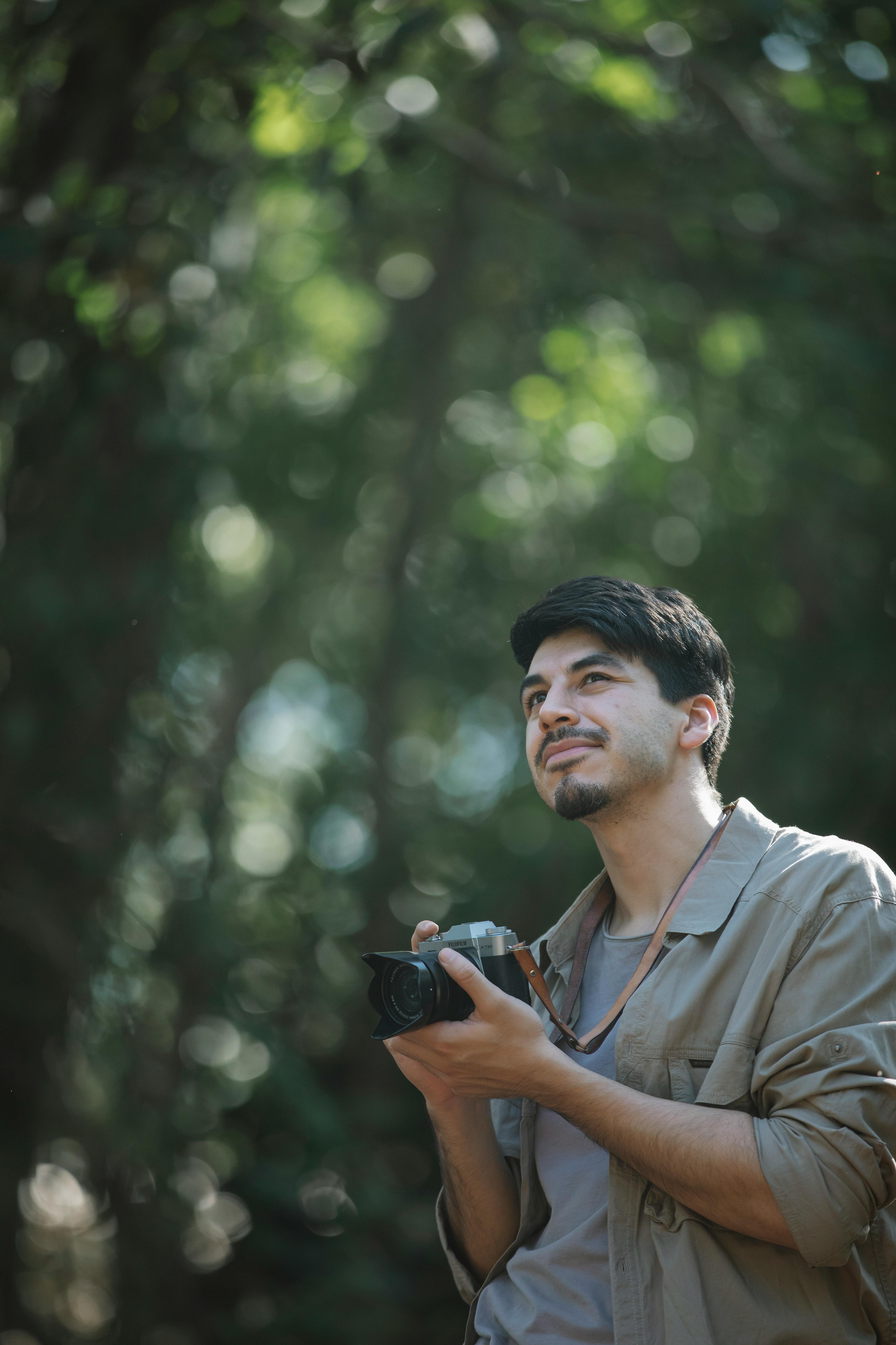 Young man resting on rural field in summer · Free Stock Photo
