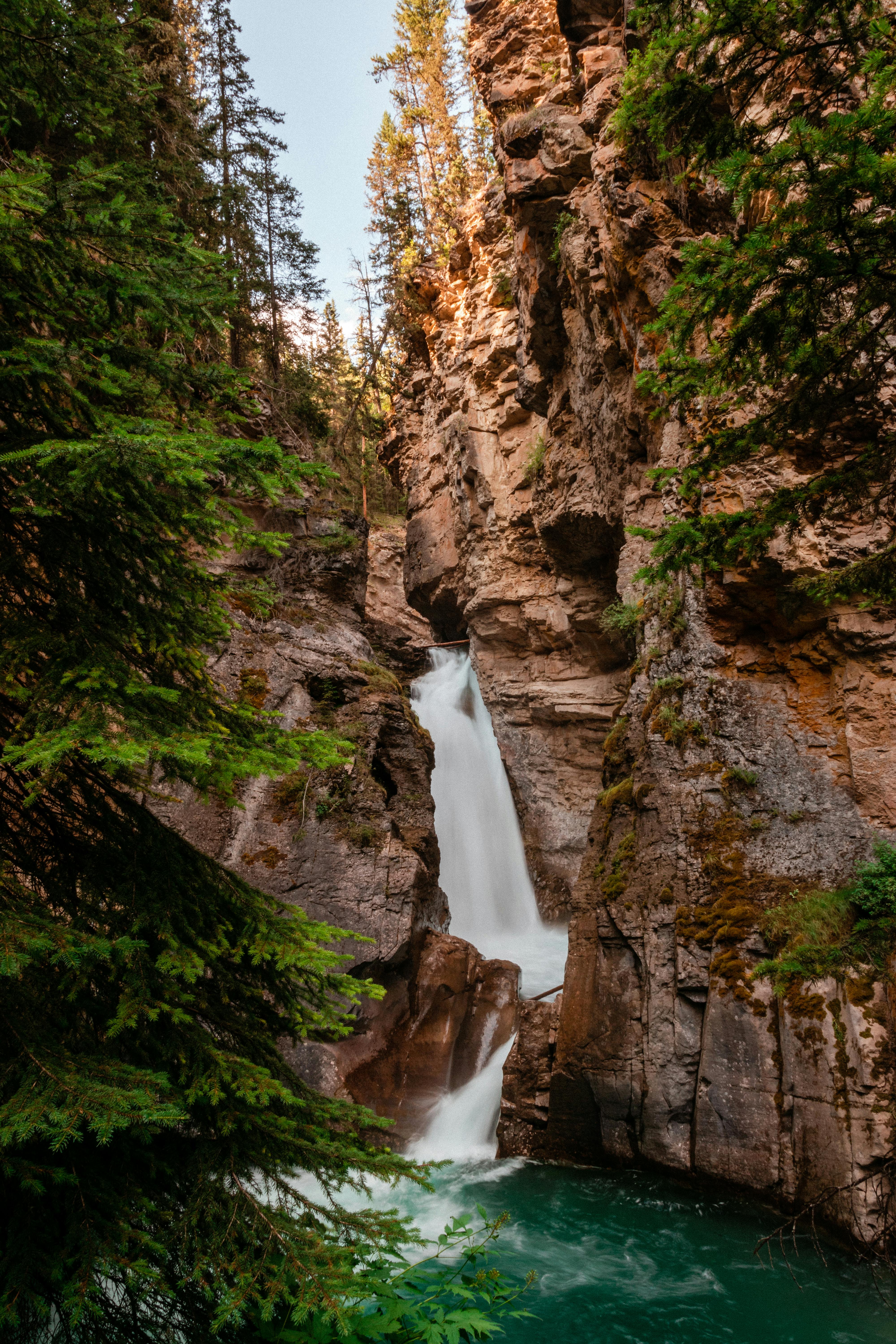 Fast waterfall streaming from rough stiff mountain · Free Stock Photo