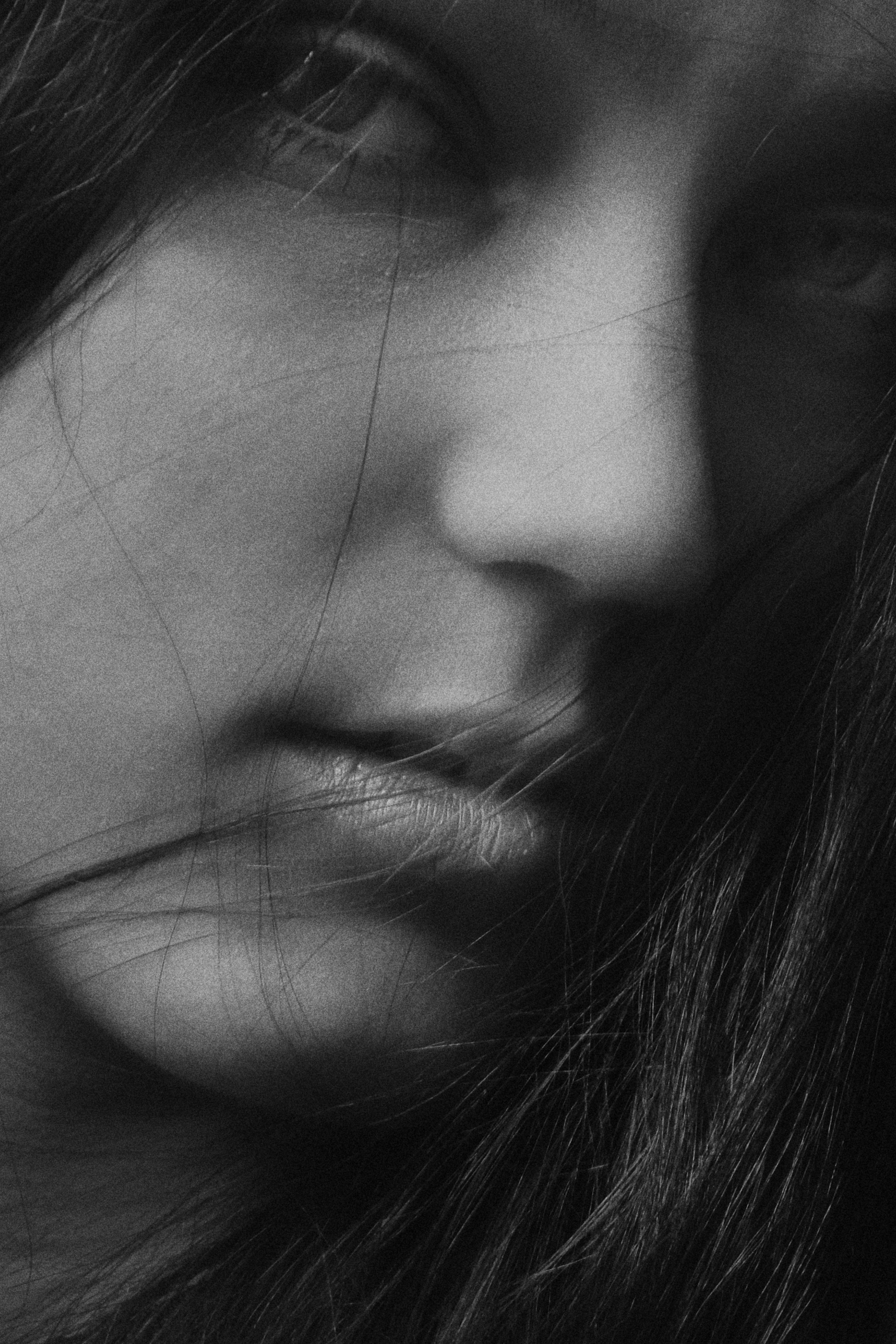 A Close-up of a Woman in Black and White · Free Stock Photo