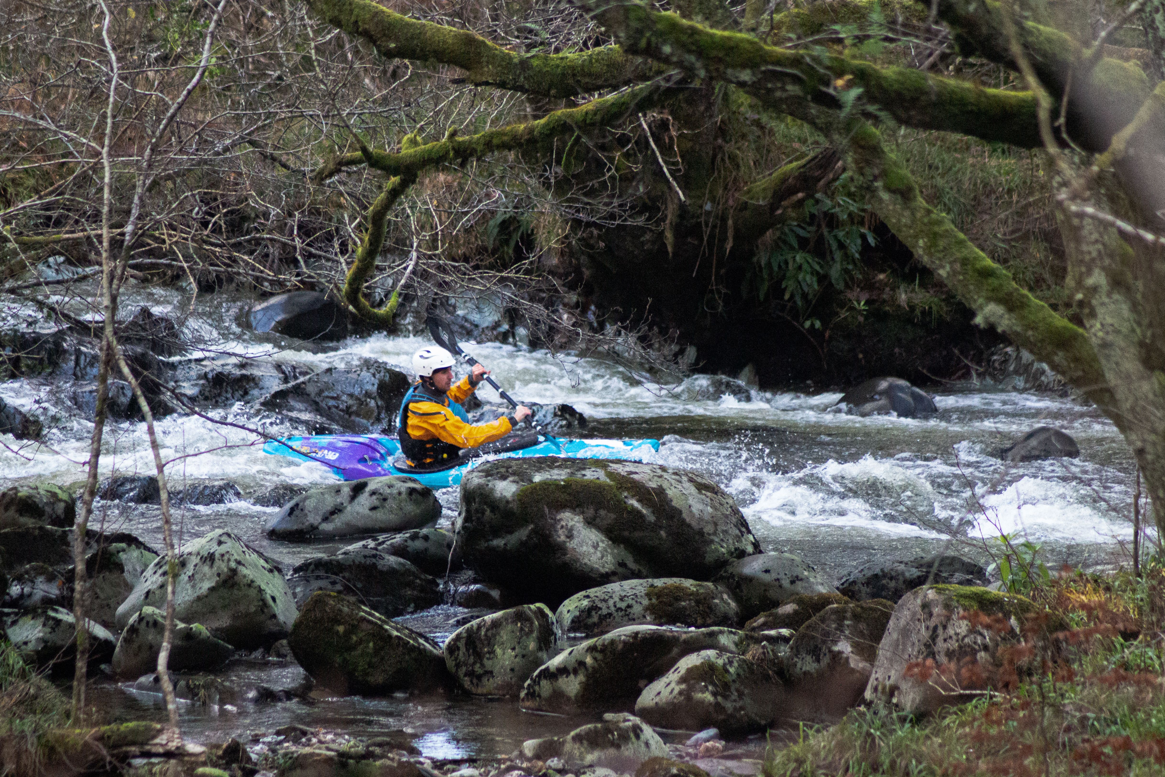 Photo of Man Paddling Kayak in Raging River · Free Stock Photo