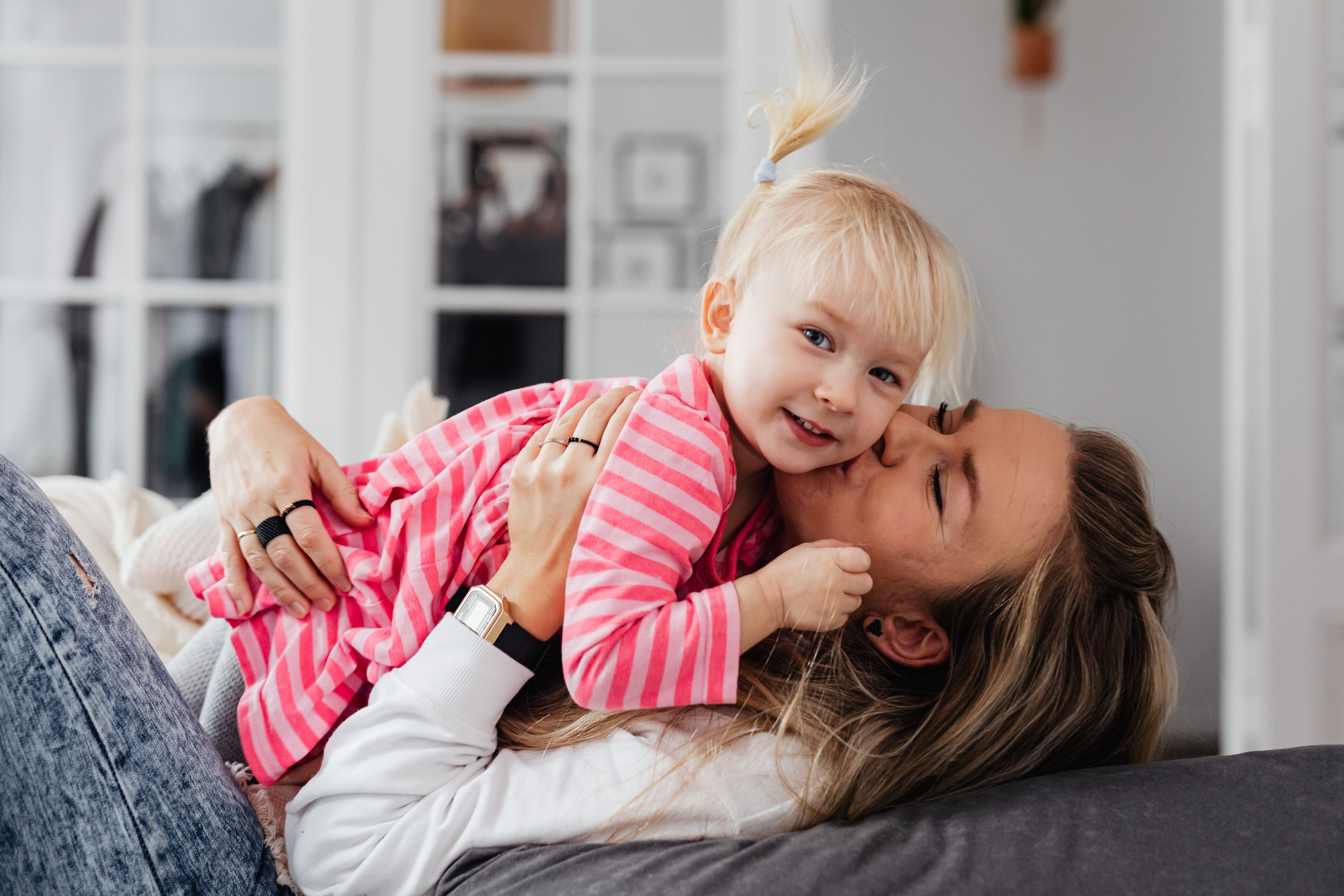 Photo Of Man Hugging Child · Free Stock Photo