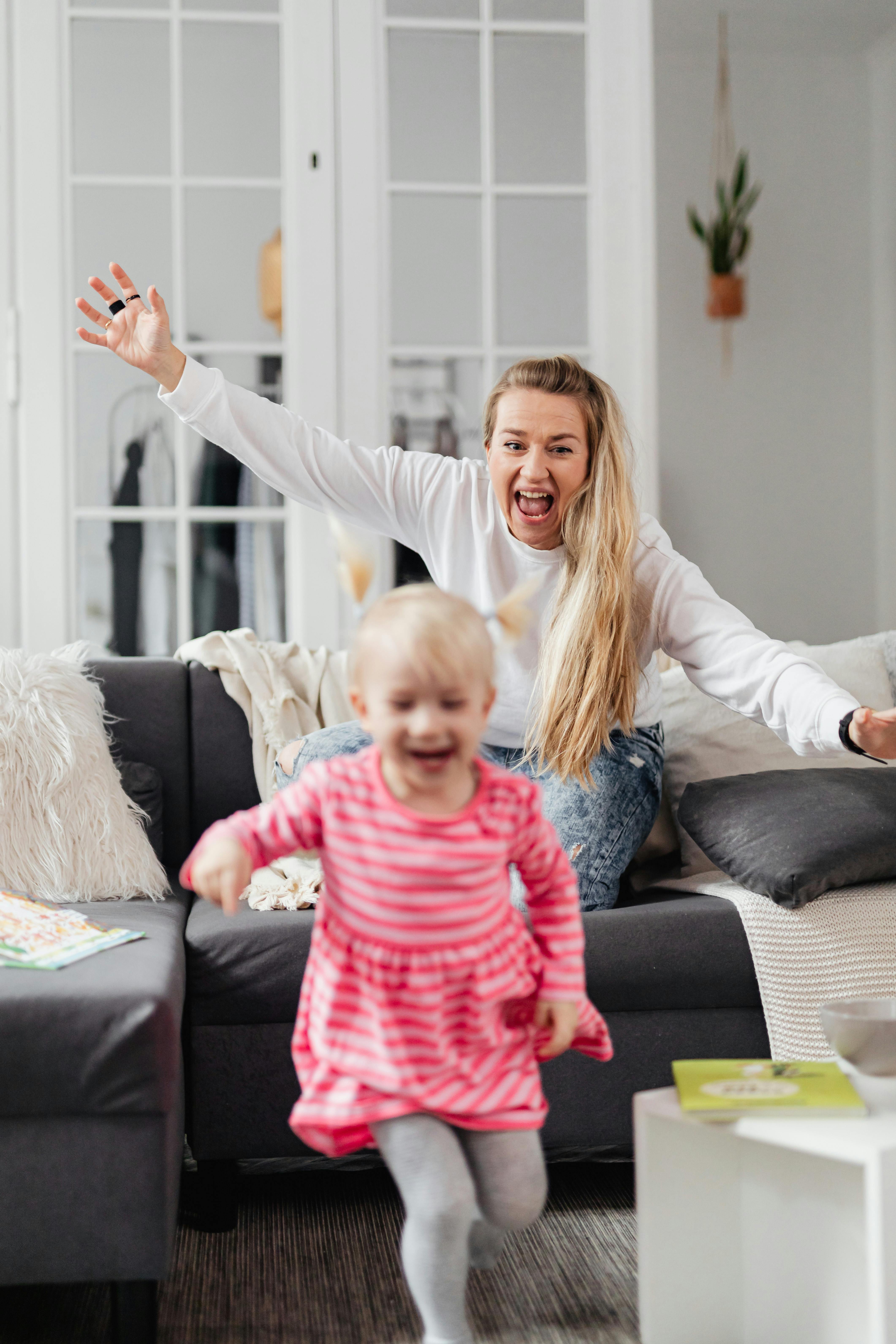 Mother Chasing Daughter in Room · Free Stock Photo