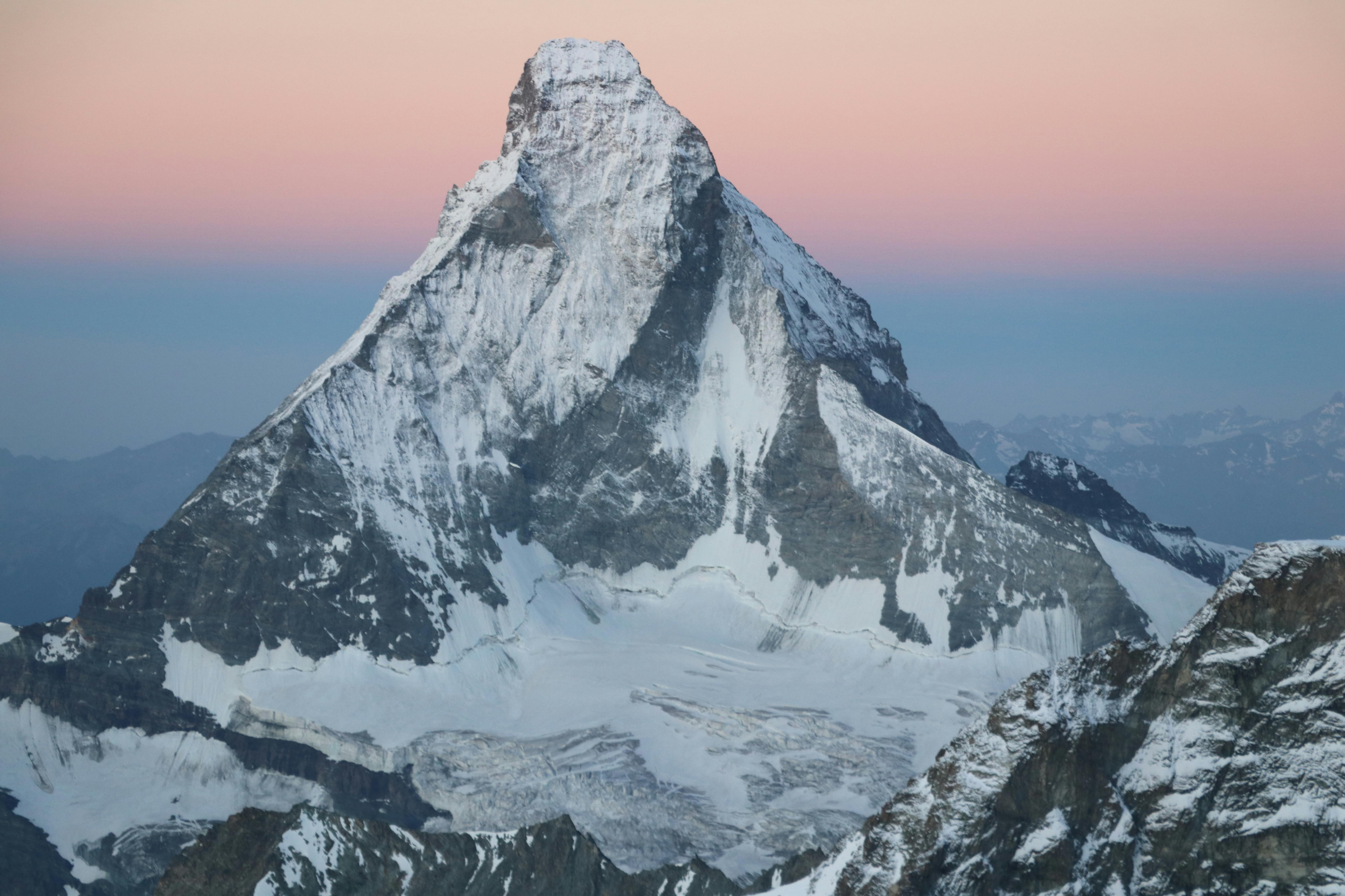 Tall Rock Mountain Covered with Snow · Free Stock Photo