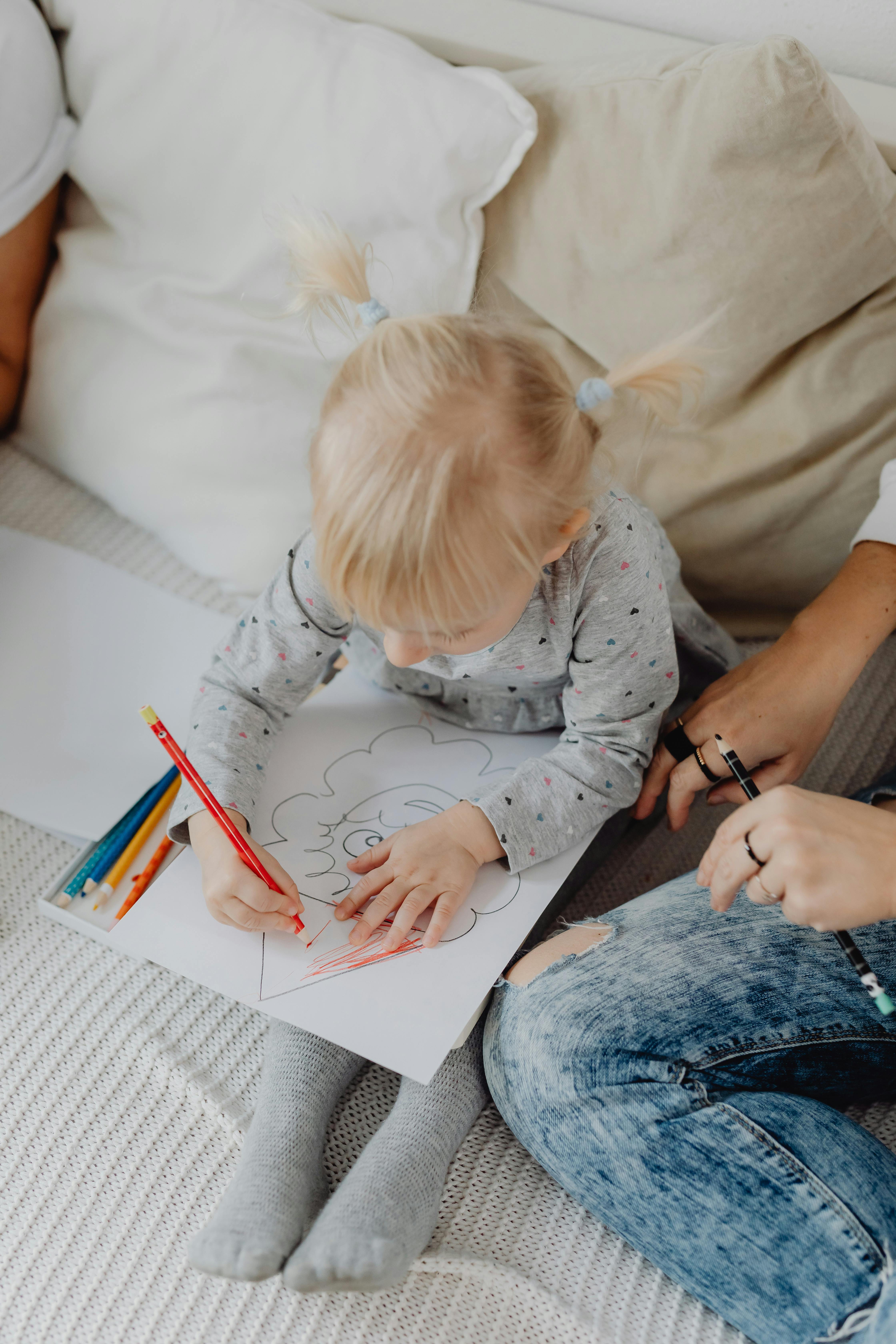 Photo of a Girl Coloring · Free Stock Photo