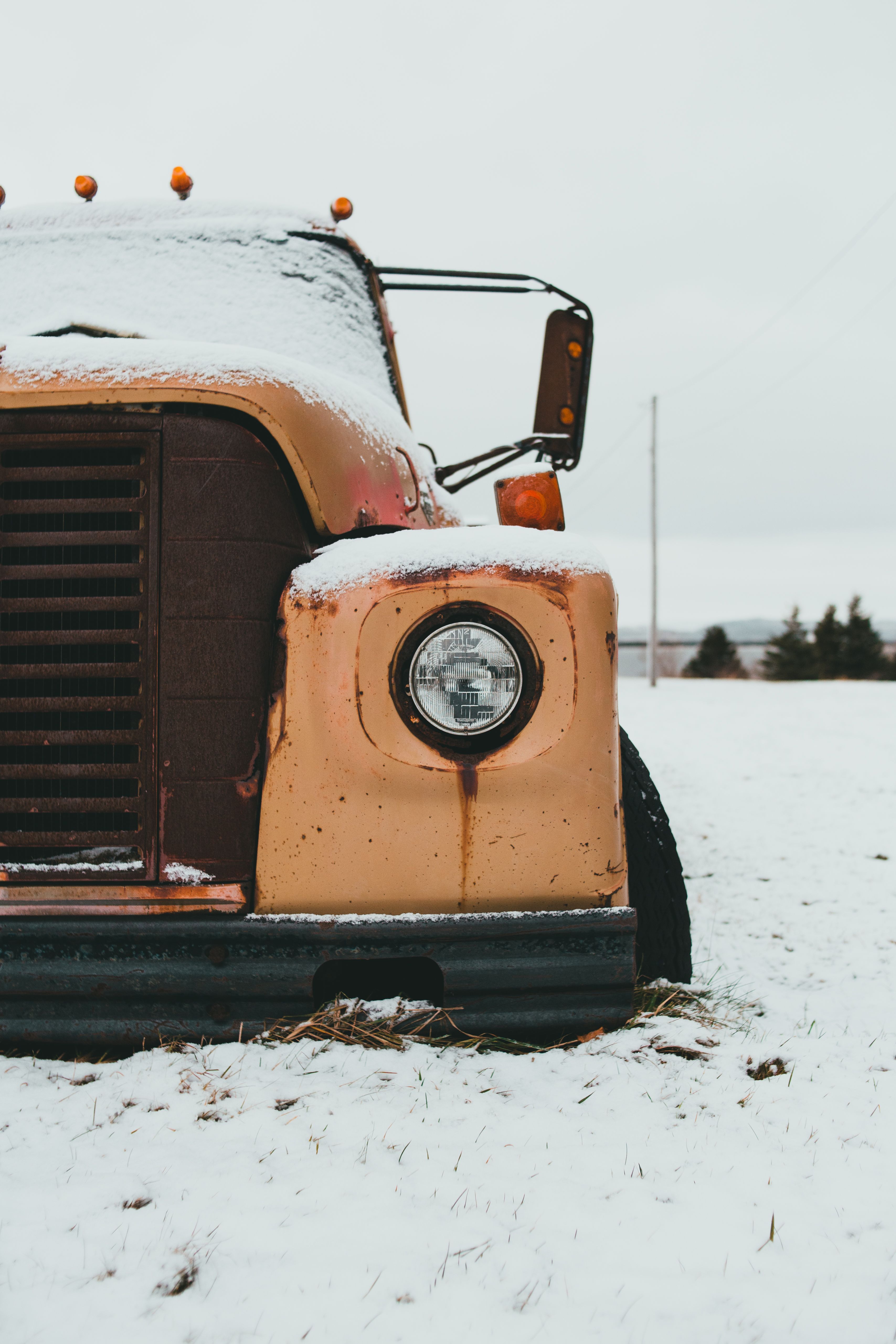 Truck on snowy ground near building · Free Stock Photo