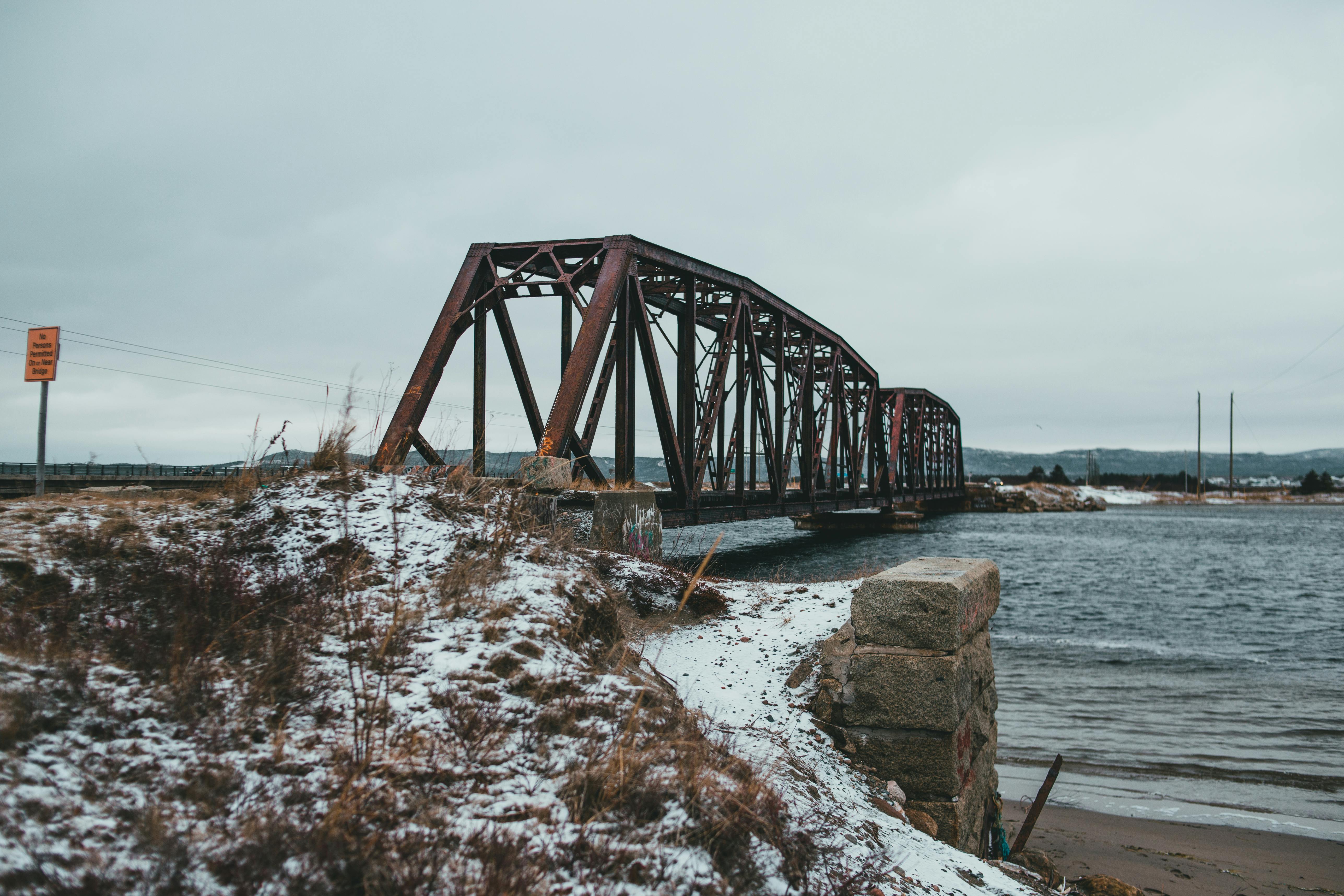 Bridge over rippling sea on winter day · Free Stock Photo