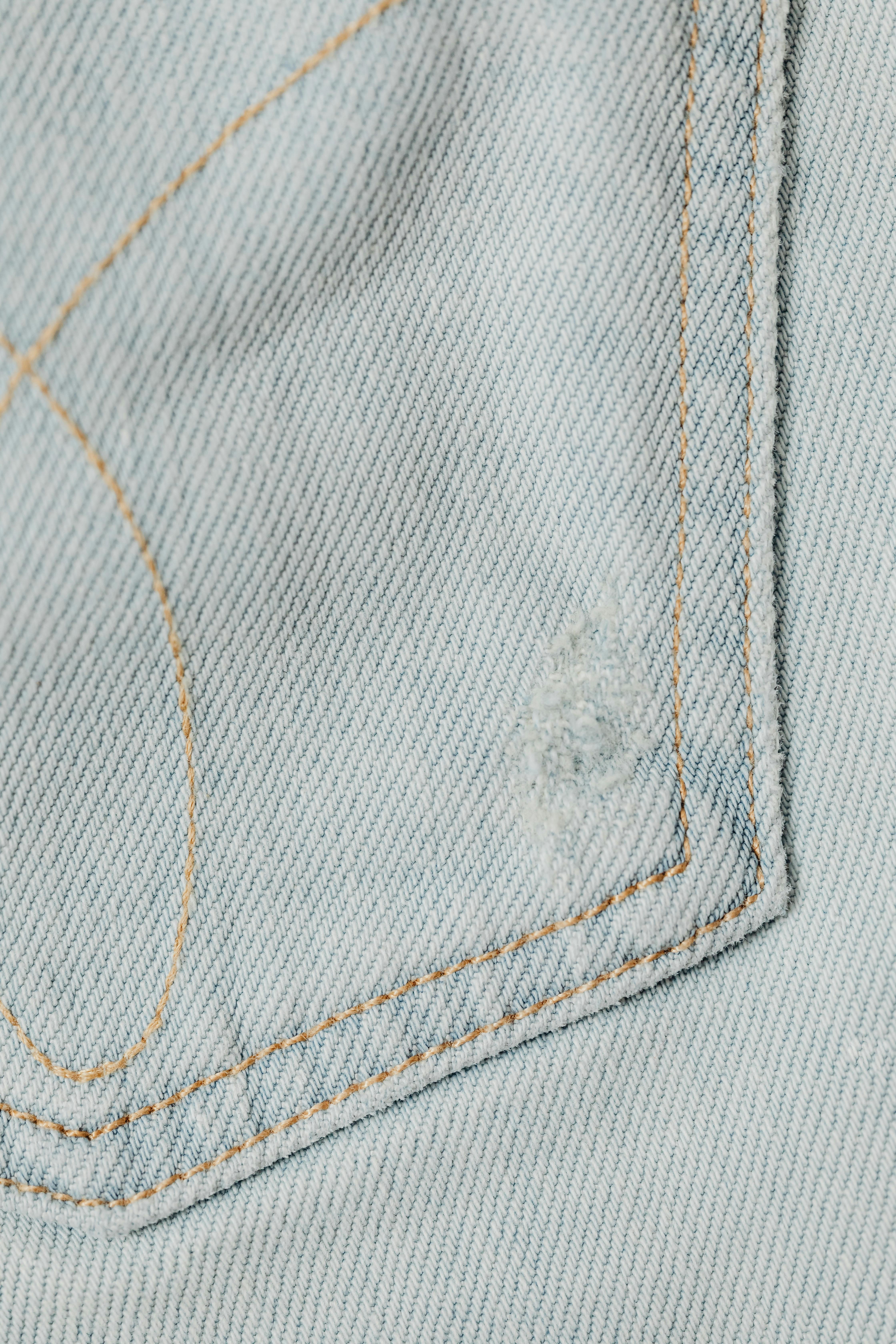 Close-Up Shot of a Denim Textile · Free Stock Photo