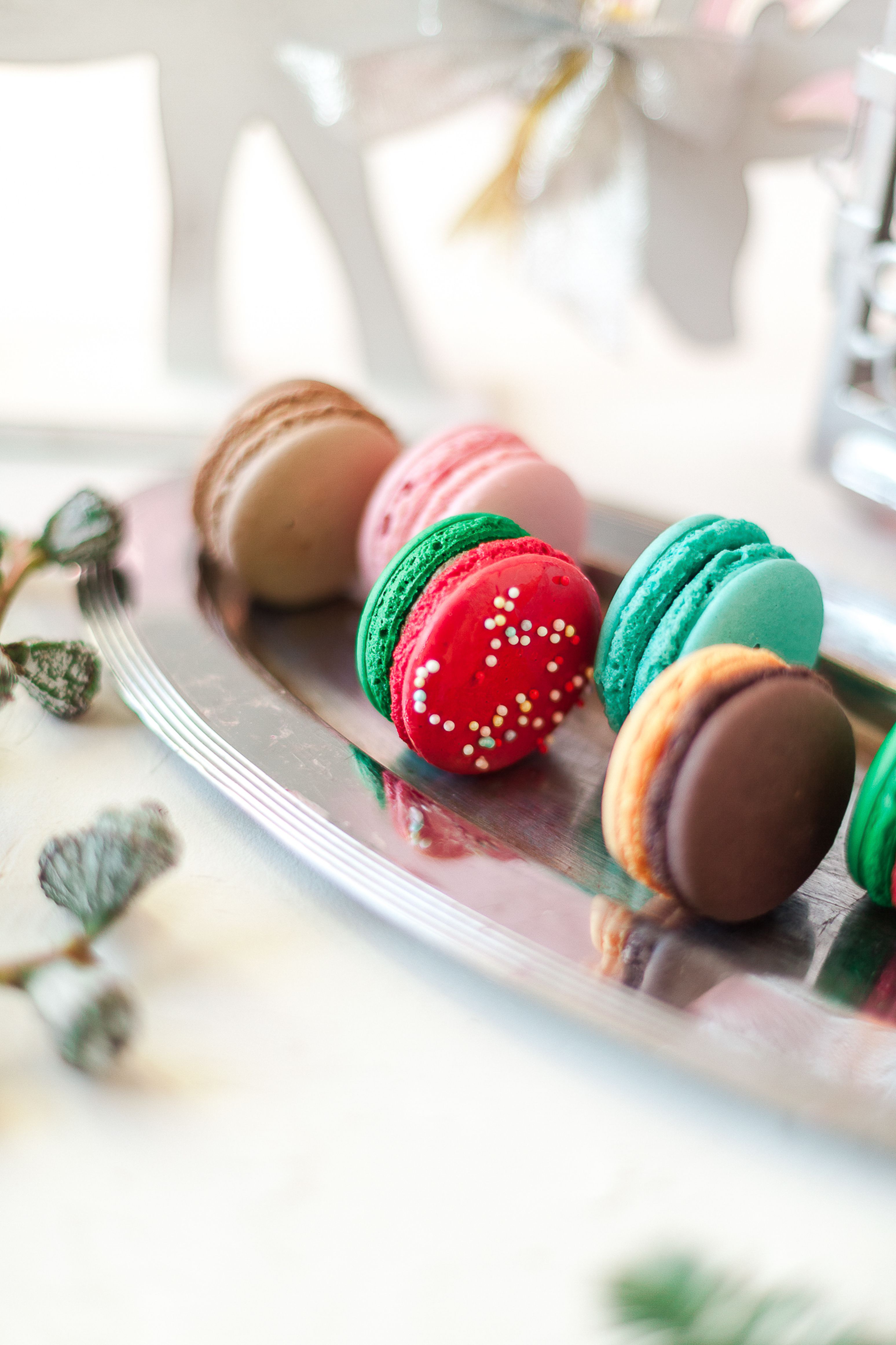 Yummy macaroons on steel tray in light room · Free Stock Photo