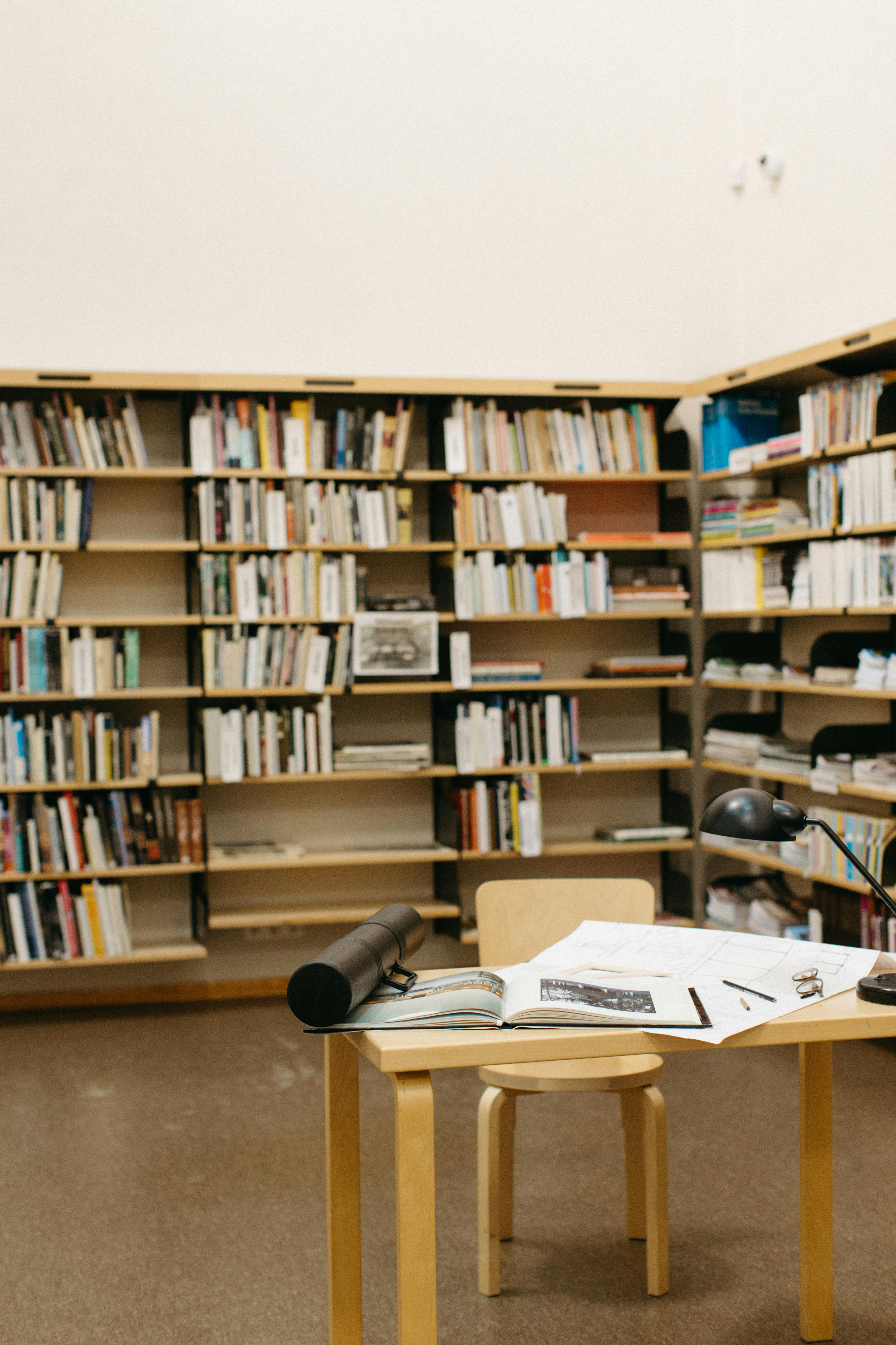 People at Library Sitting Down at Tables · Free Stock Photo