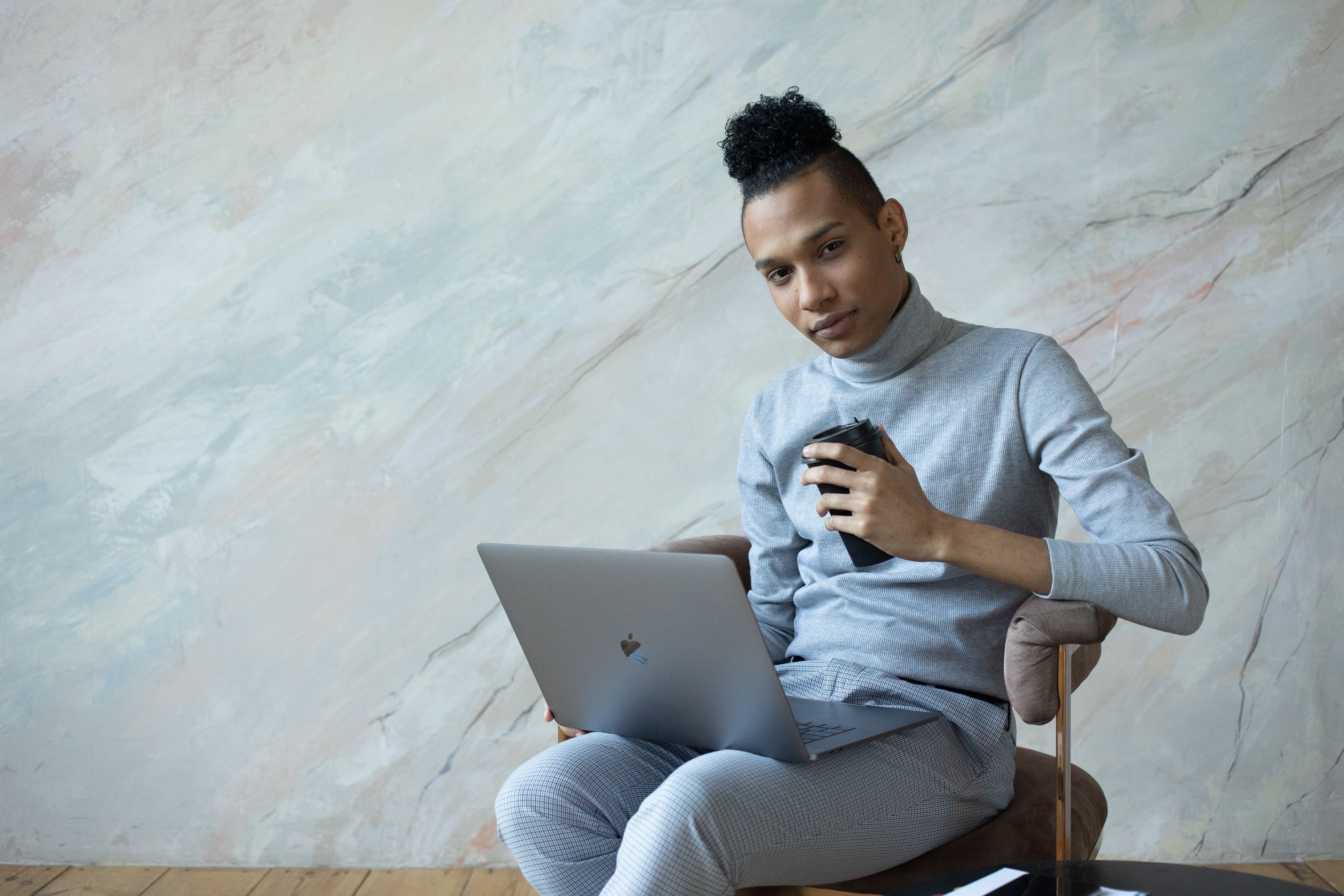 Young man using laptop on floor · Free Stock Photo