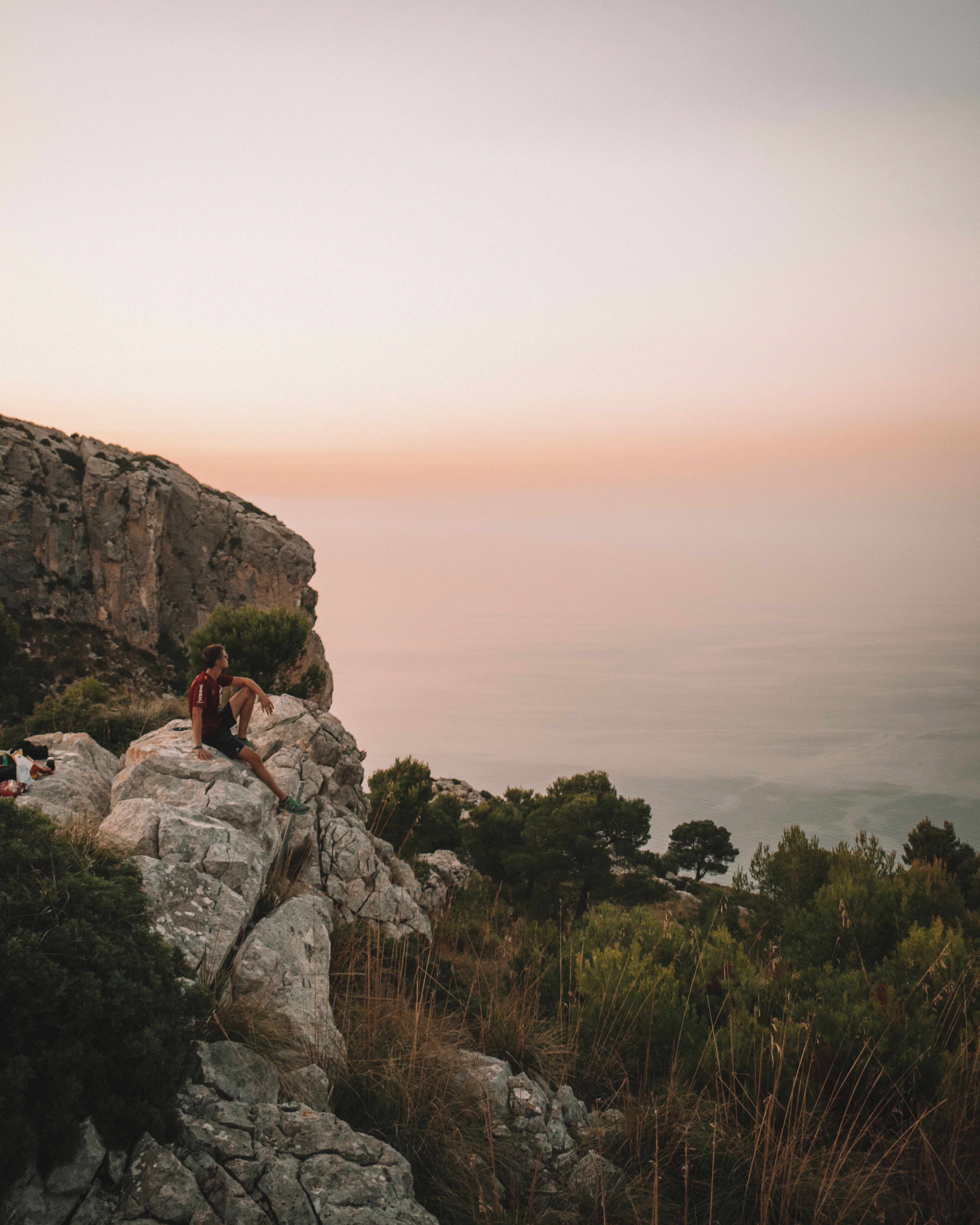 A Woman Resting on a Rock · Free Stock Photo