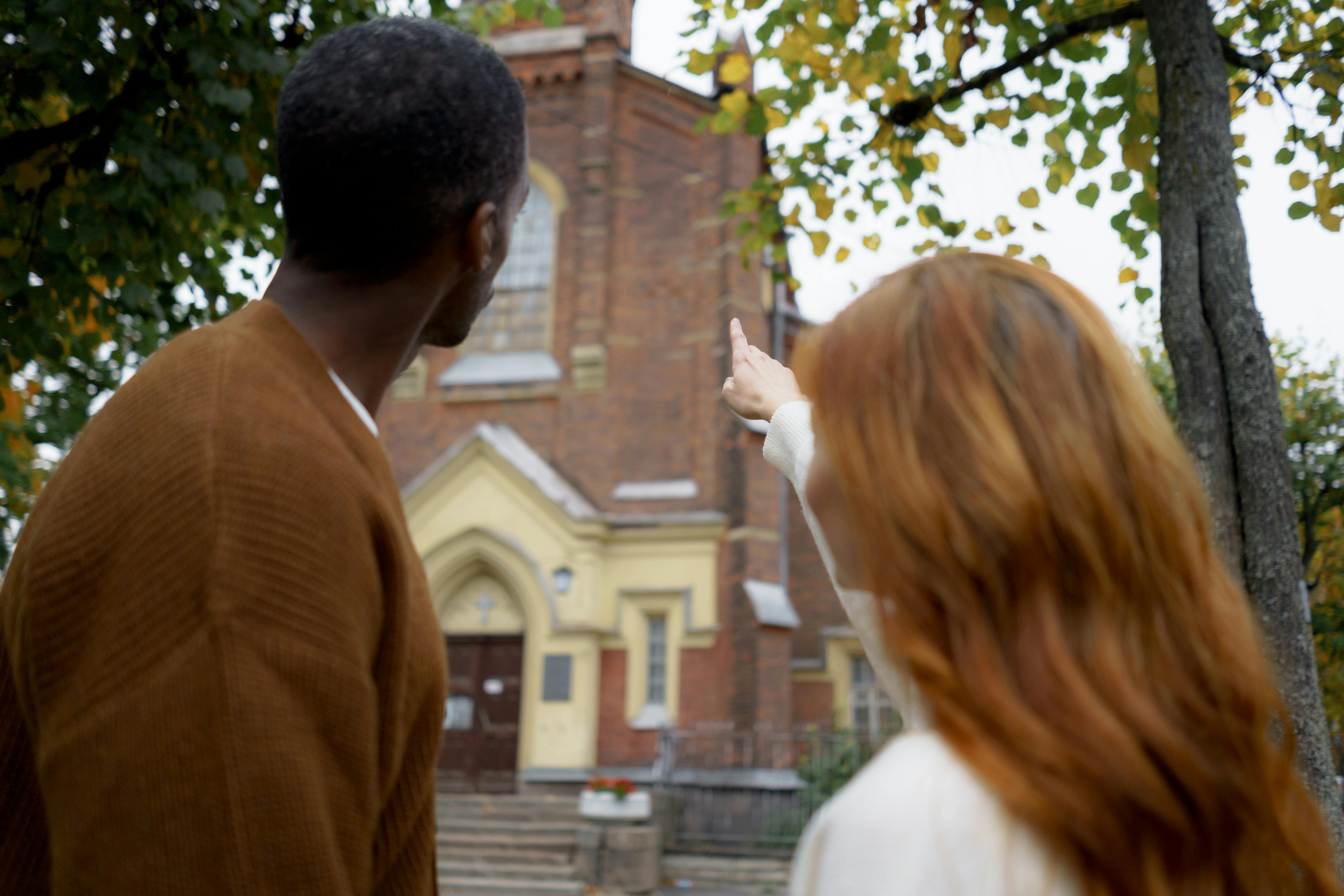 Person Pointing at the Church · Free Stock Photo