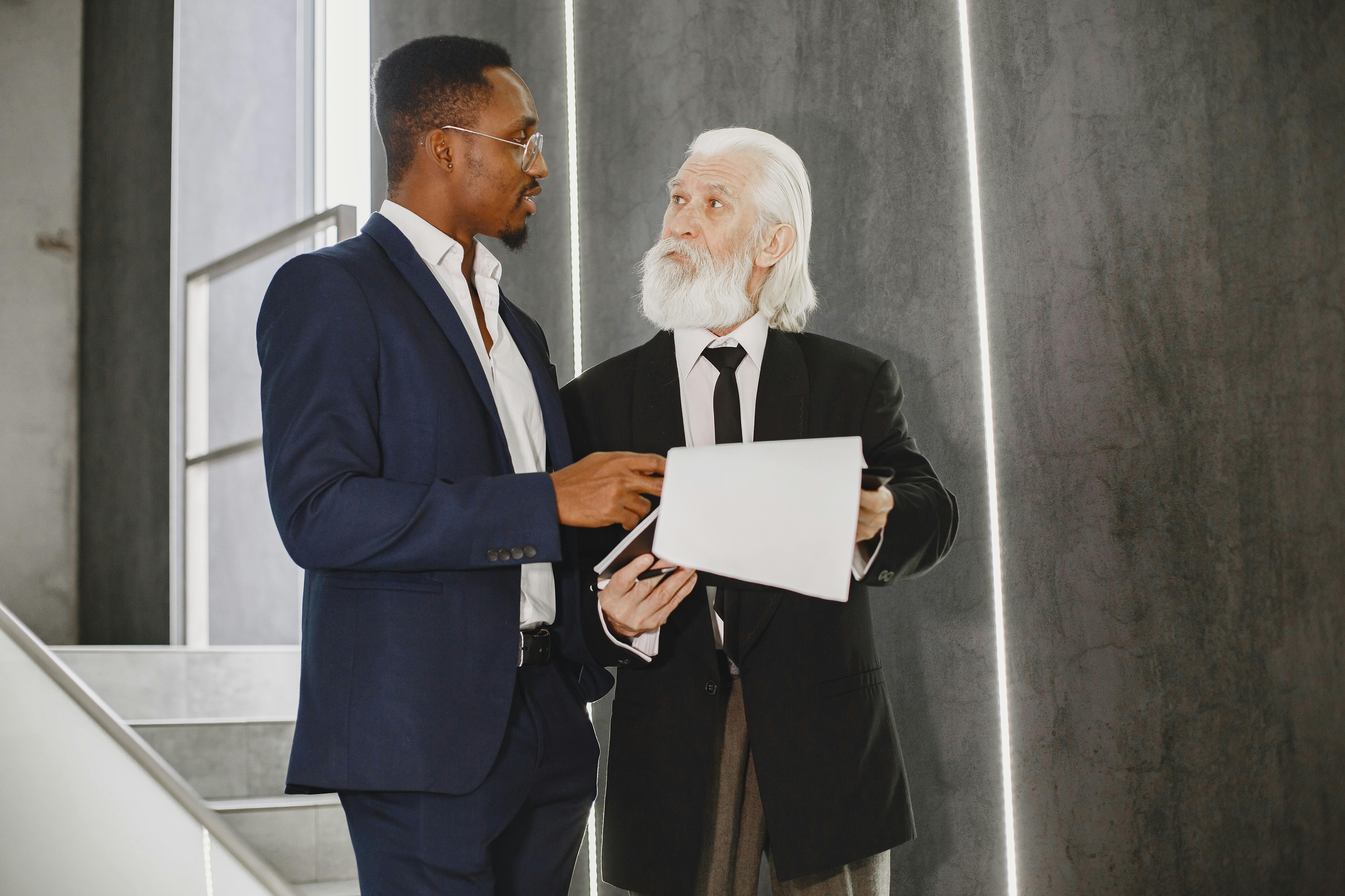 Men Talking on Stairs · Free Stock Photo