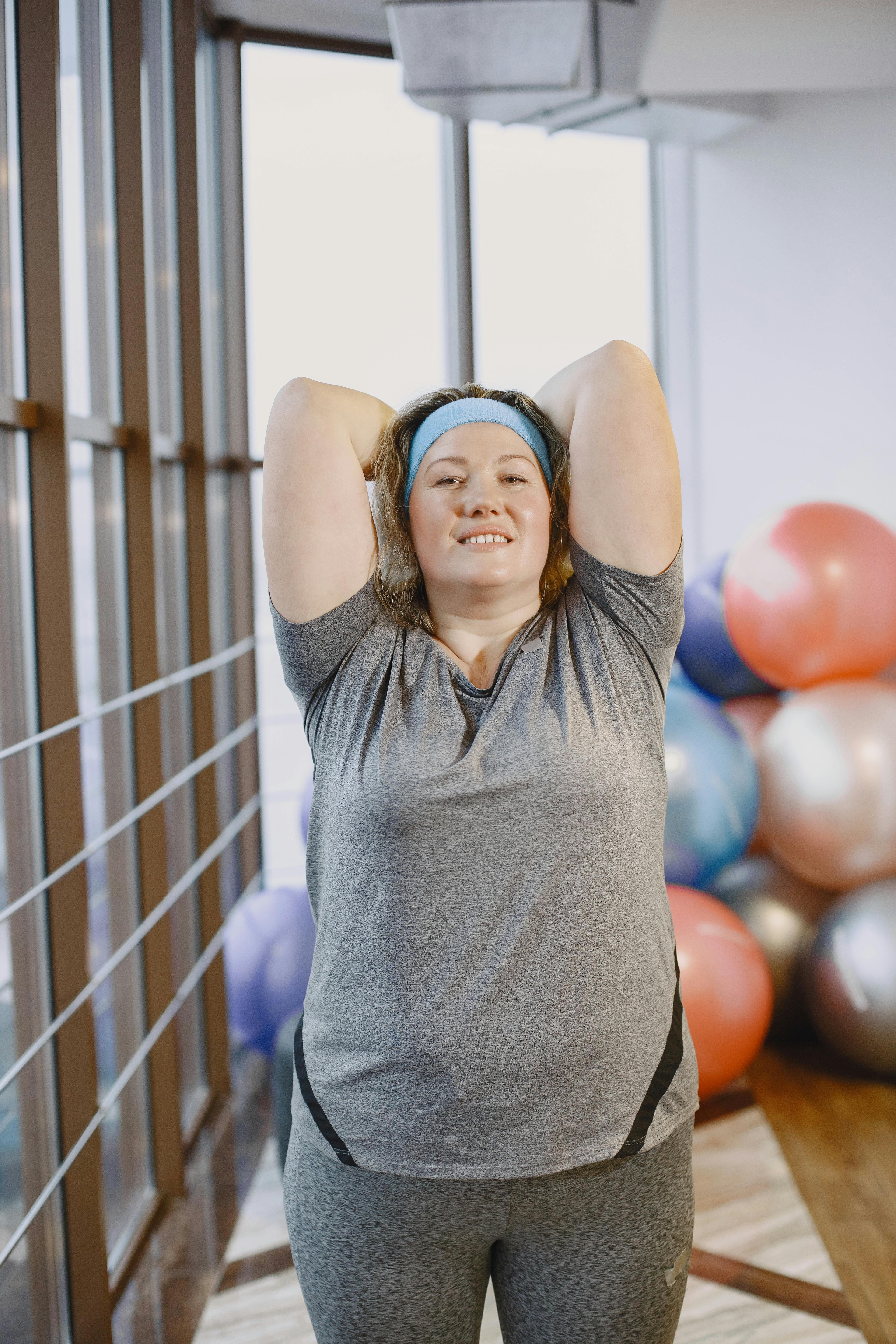 Plus Size Woman during Workout at Gym · Free Stock Photo
